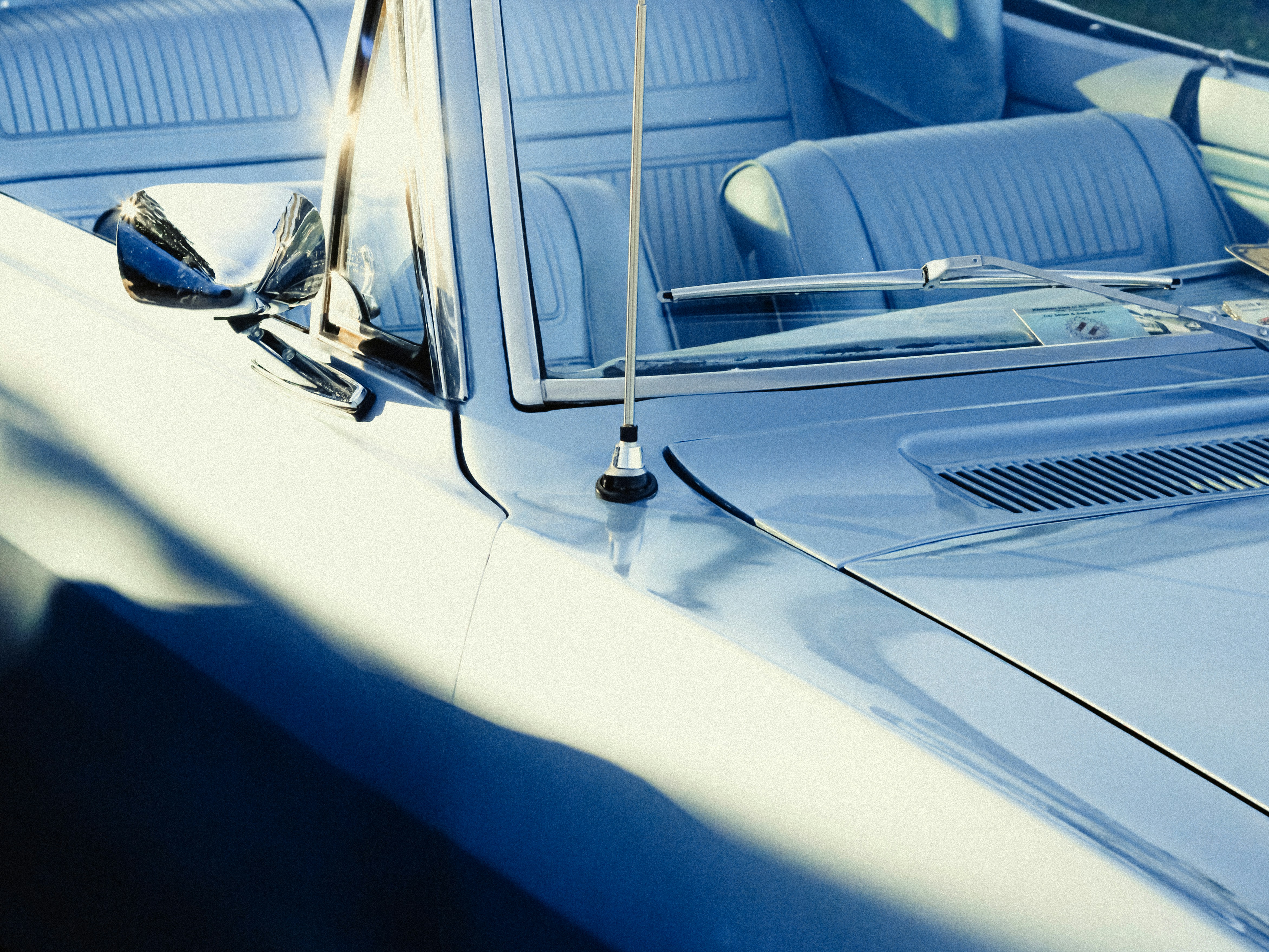 Chrome Reflection on a Classic Convertible