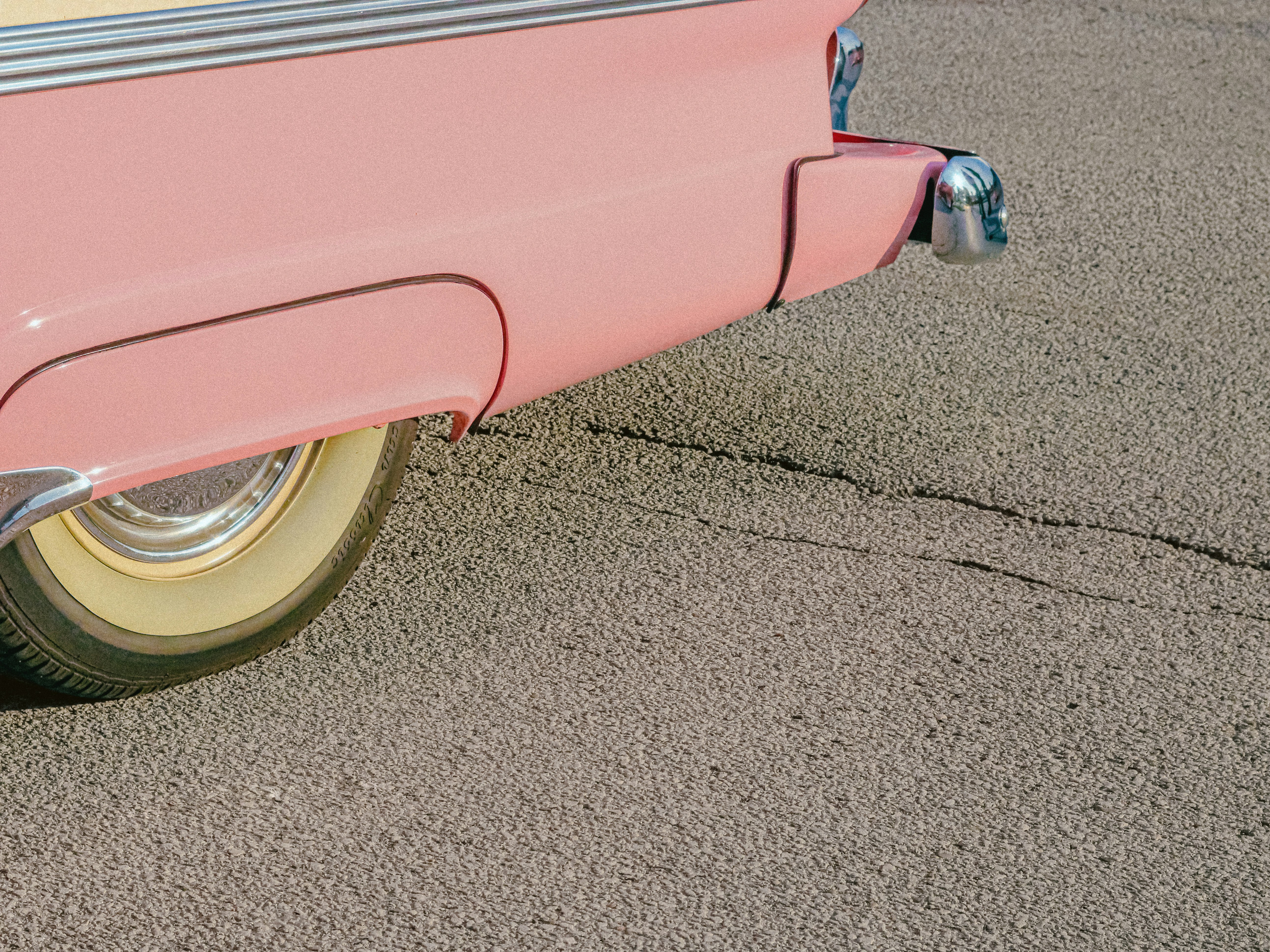 Pastel Roadside: The Soft Curve of a Pink Vintage Tail