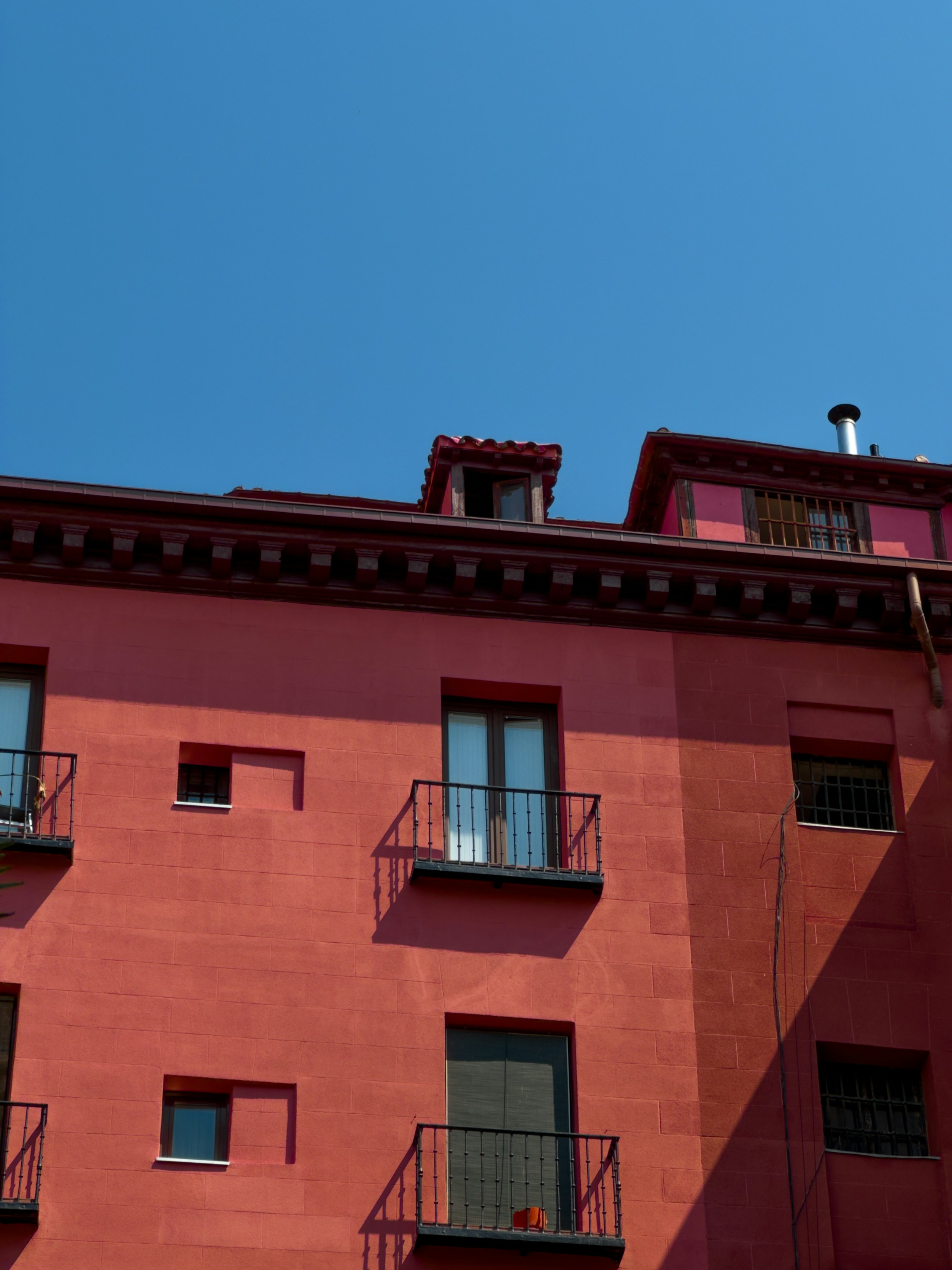 Terracotta Facade Under a Clear Blue Sky