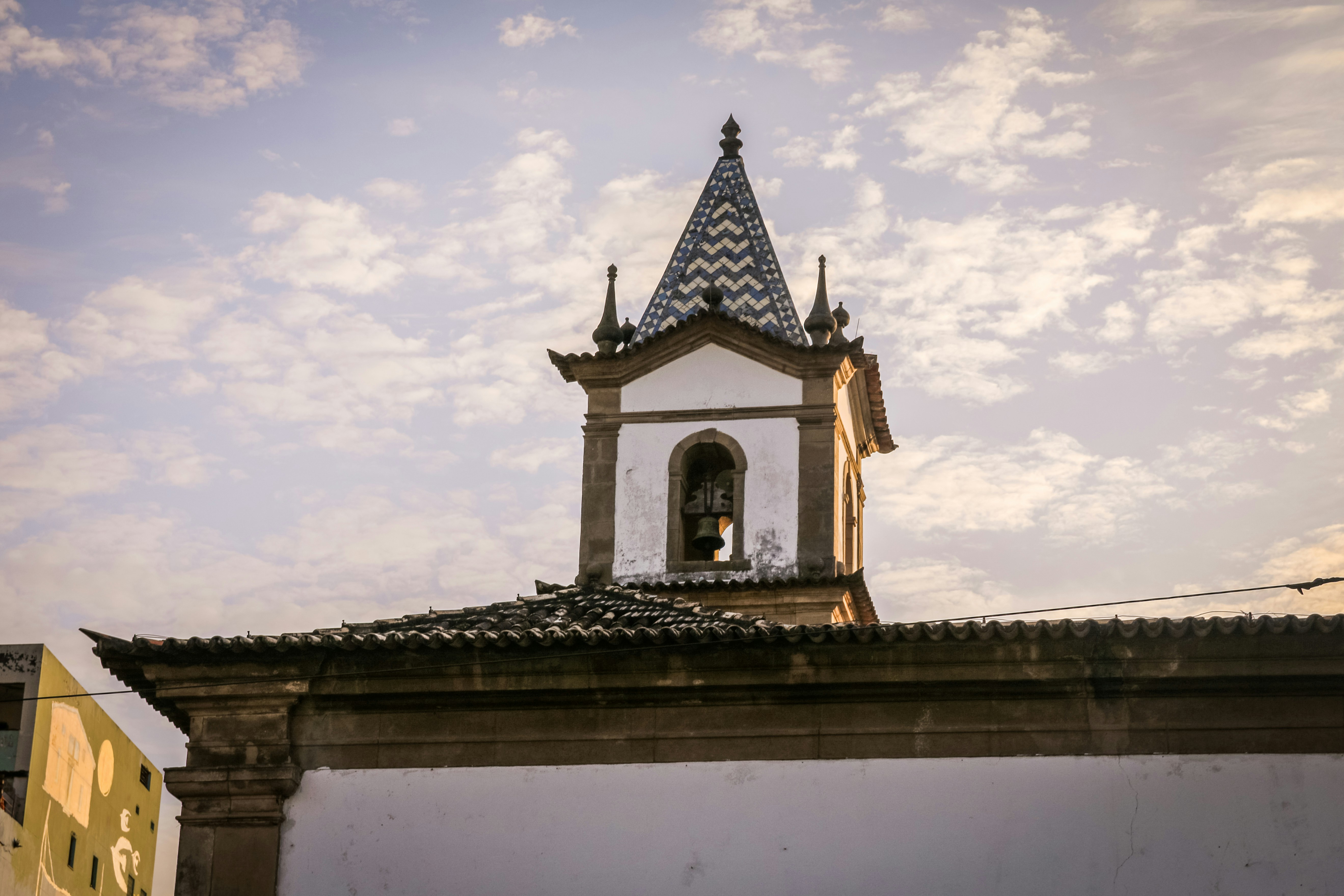 Bell Tower Sunset Over a Quiet Street