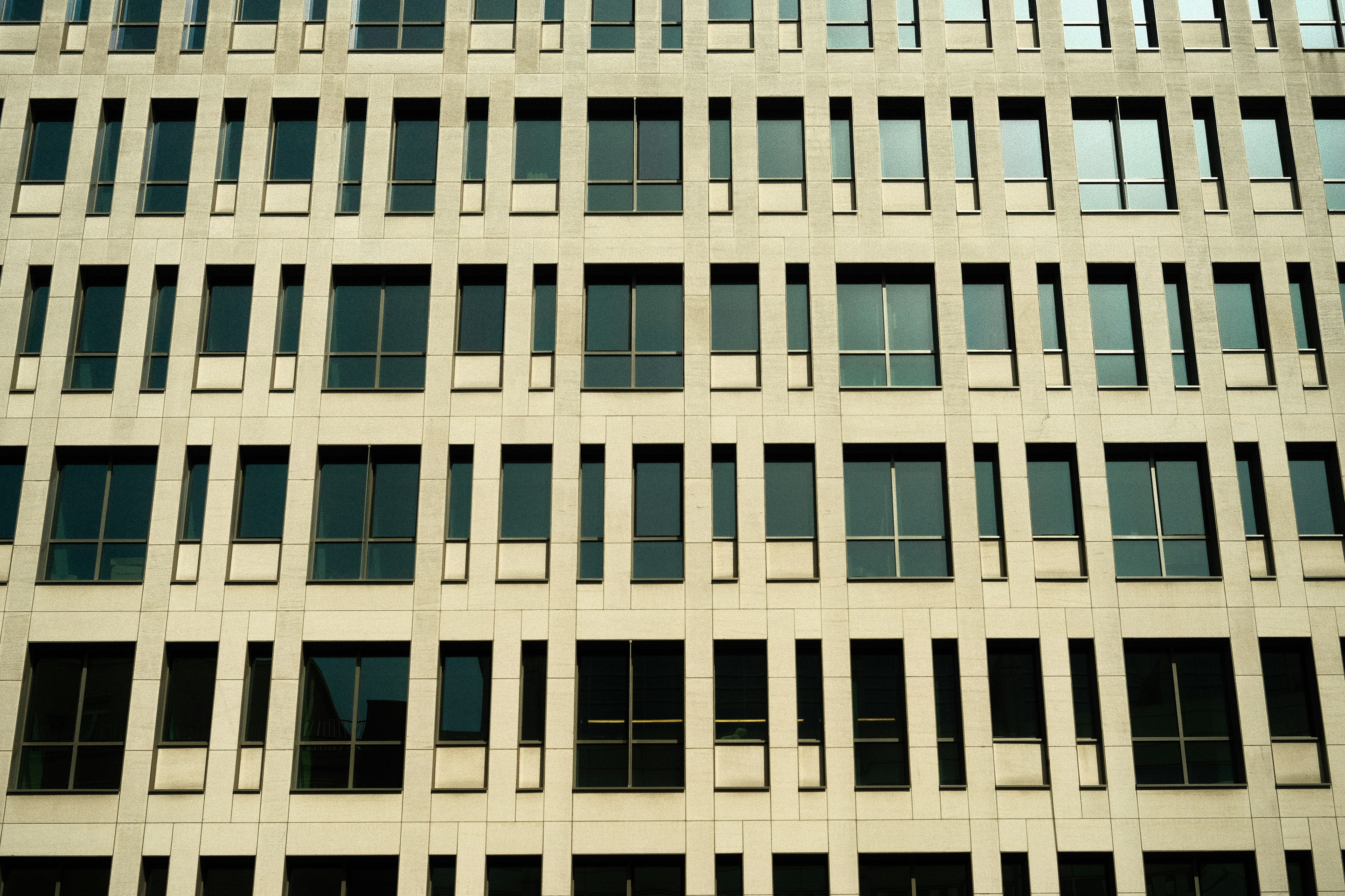 Grid of Windows: A Repeating Facade in Broken Symmetry