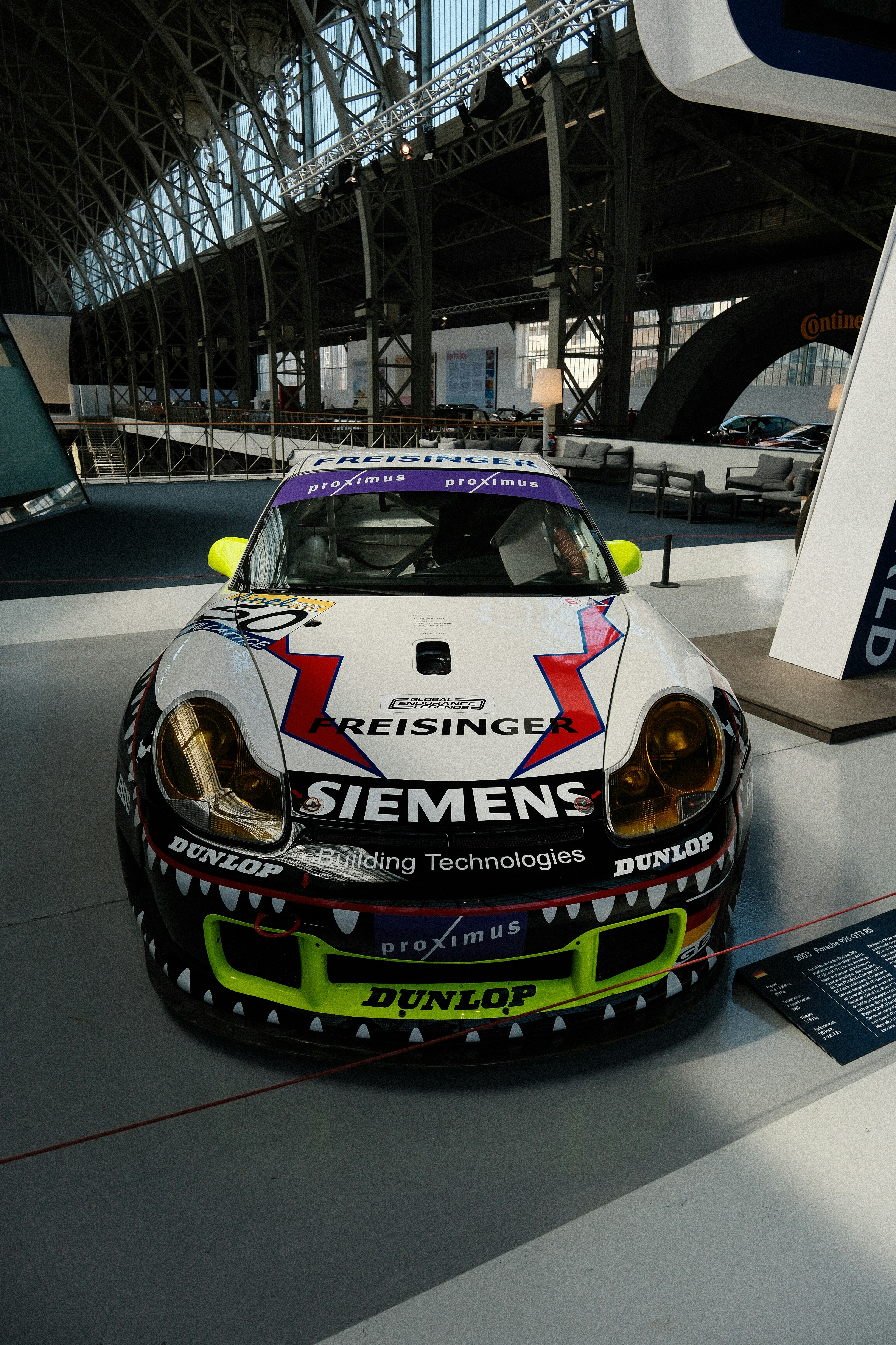 Racing Livery Confronts the Expo Hall: A Toyota of Steel and Color