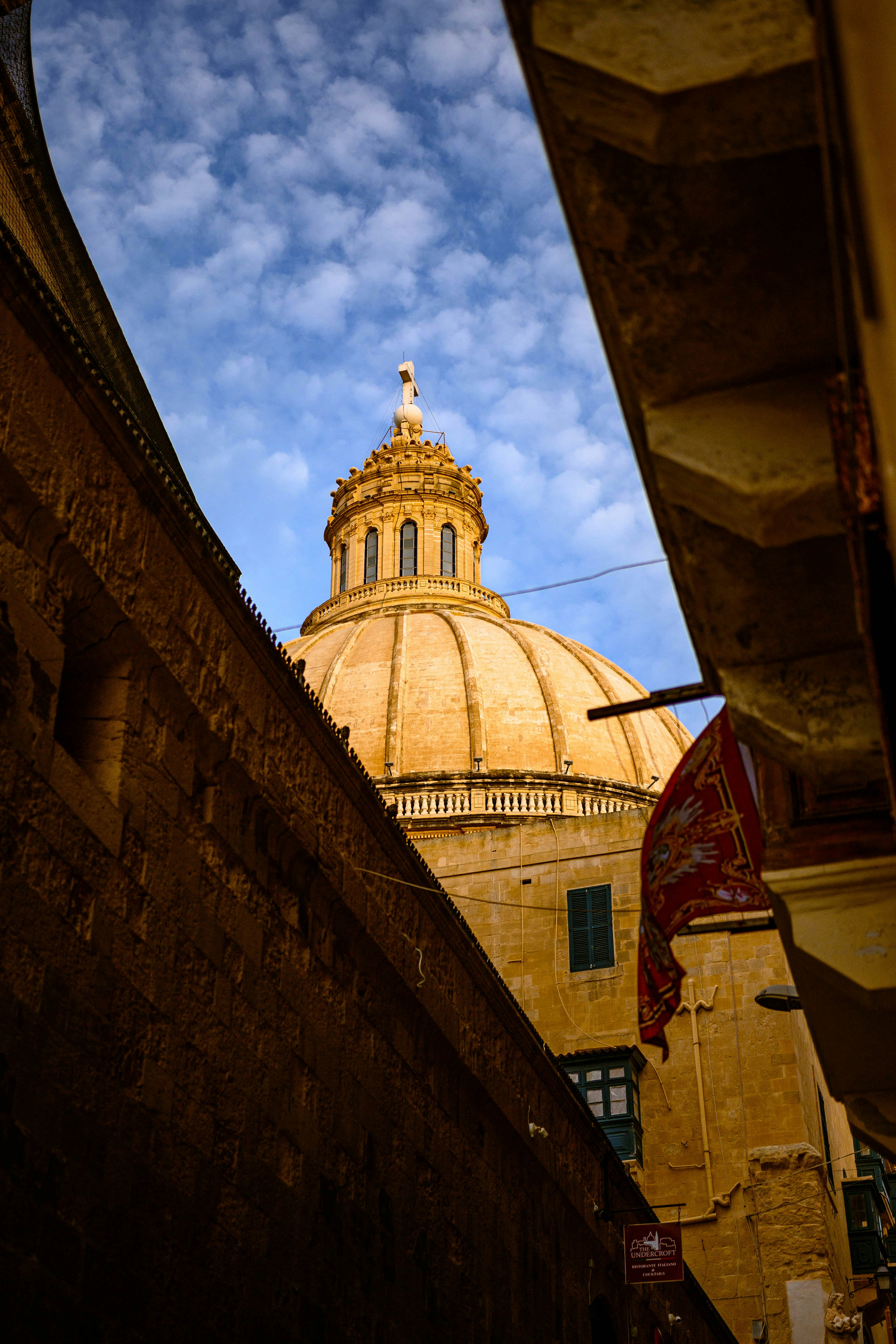 Dome Above the Alley: Golden Light on a City Summit