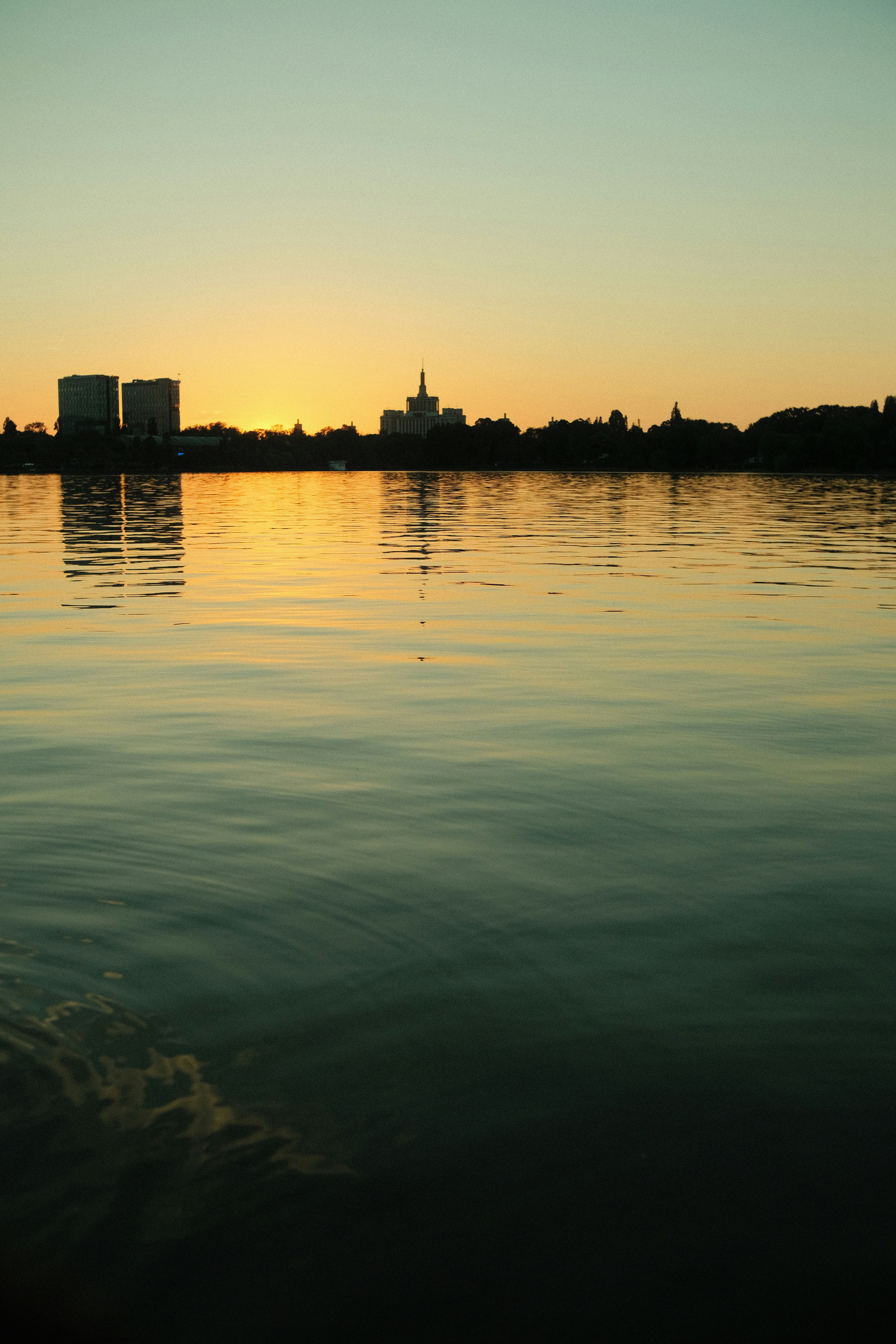 Twilight Skyline Across Quiet Water