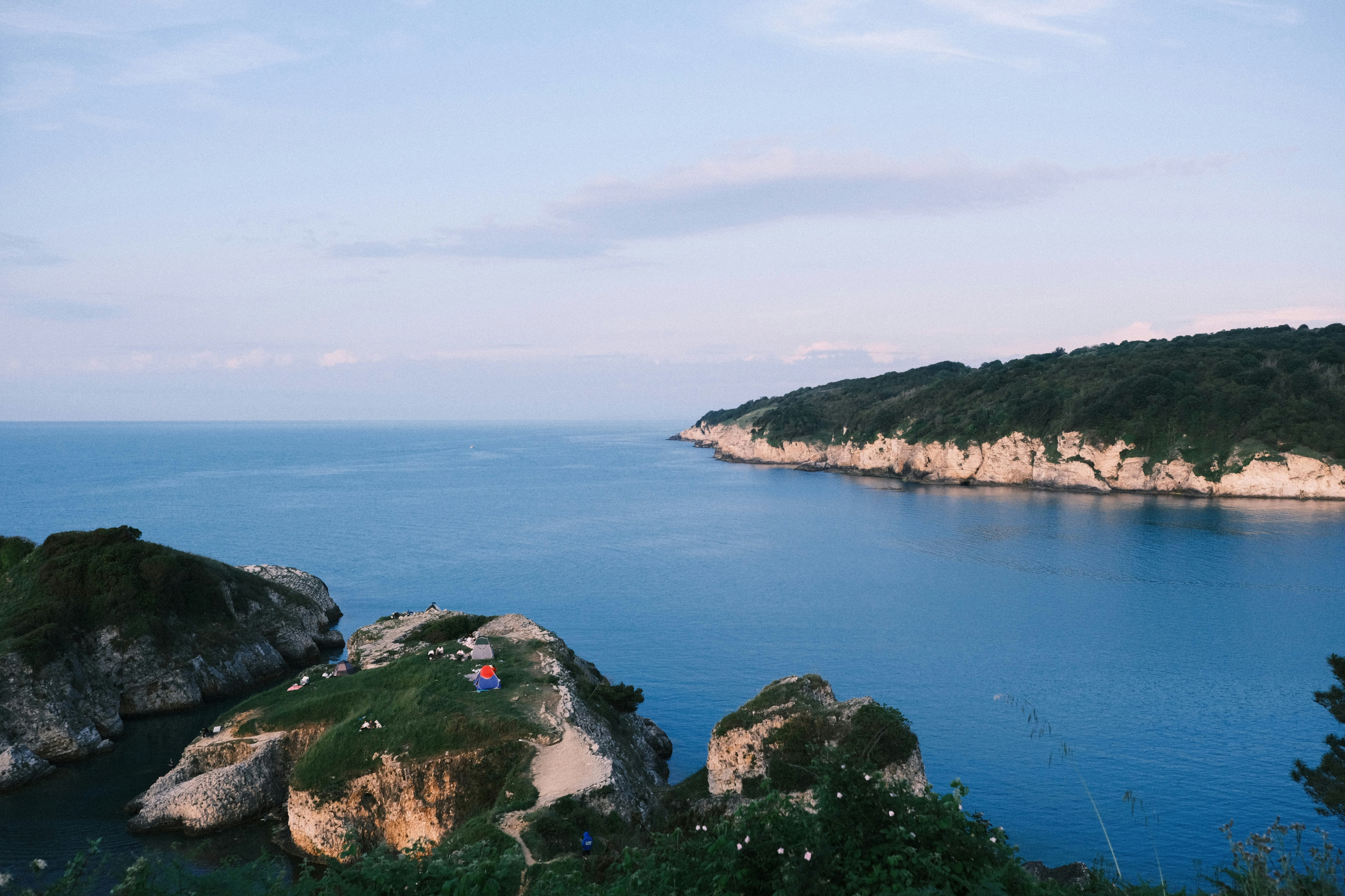Cliff-top Cove: A Quiet Vista Over Blue Expanse