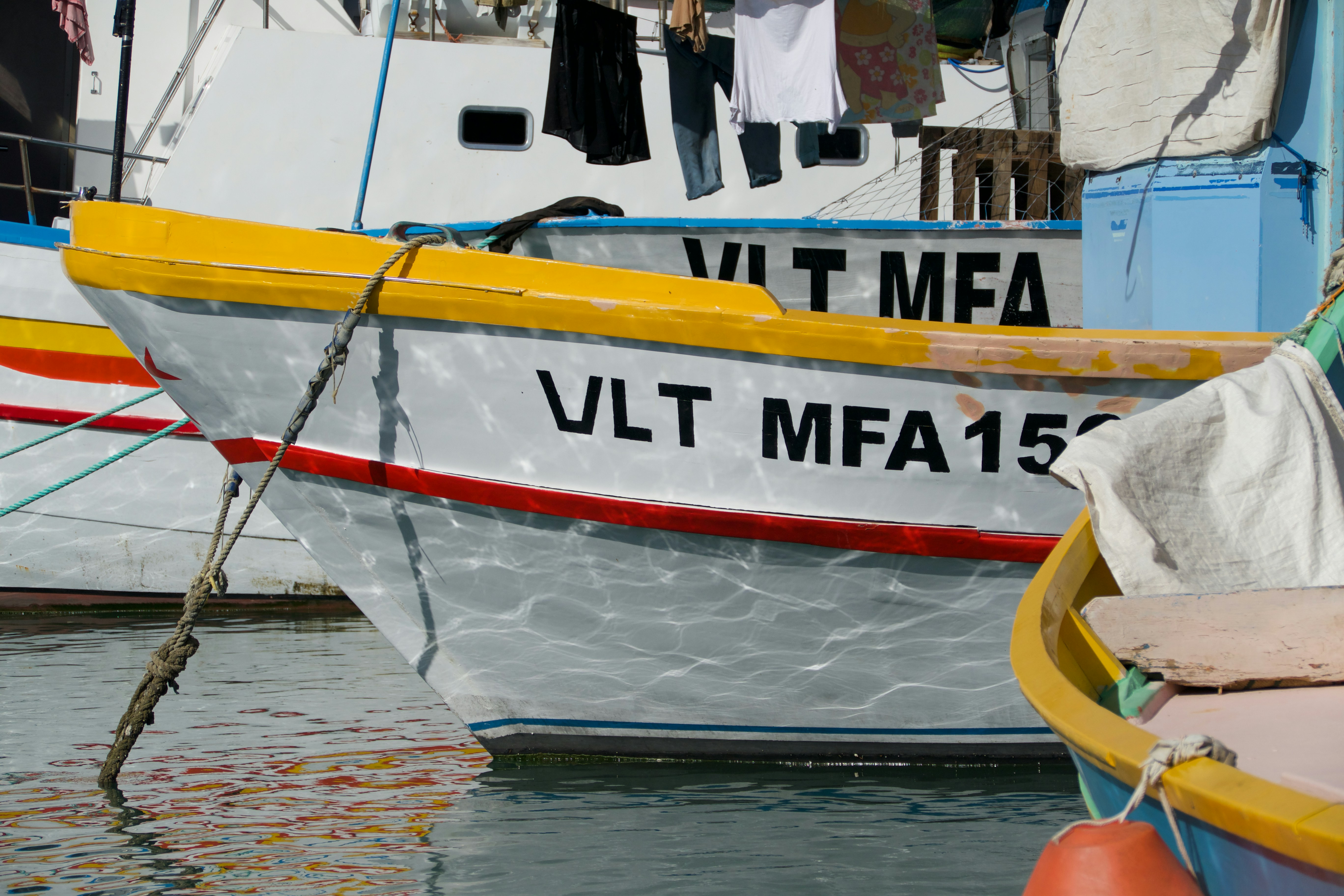 Bright Harbor Boats with Painted Hulls and Reflections