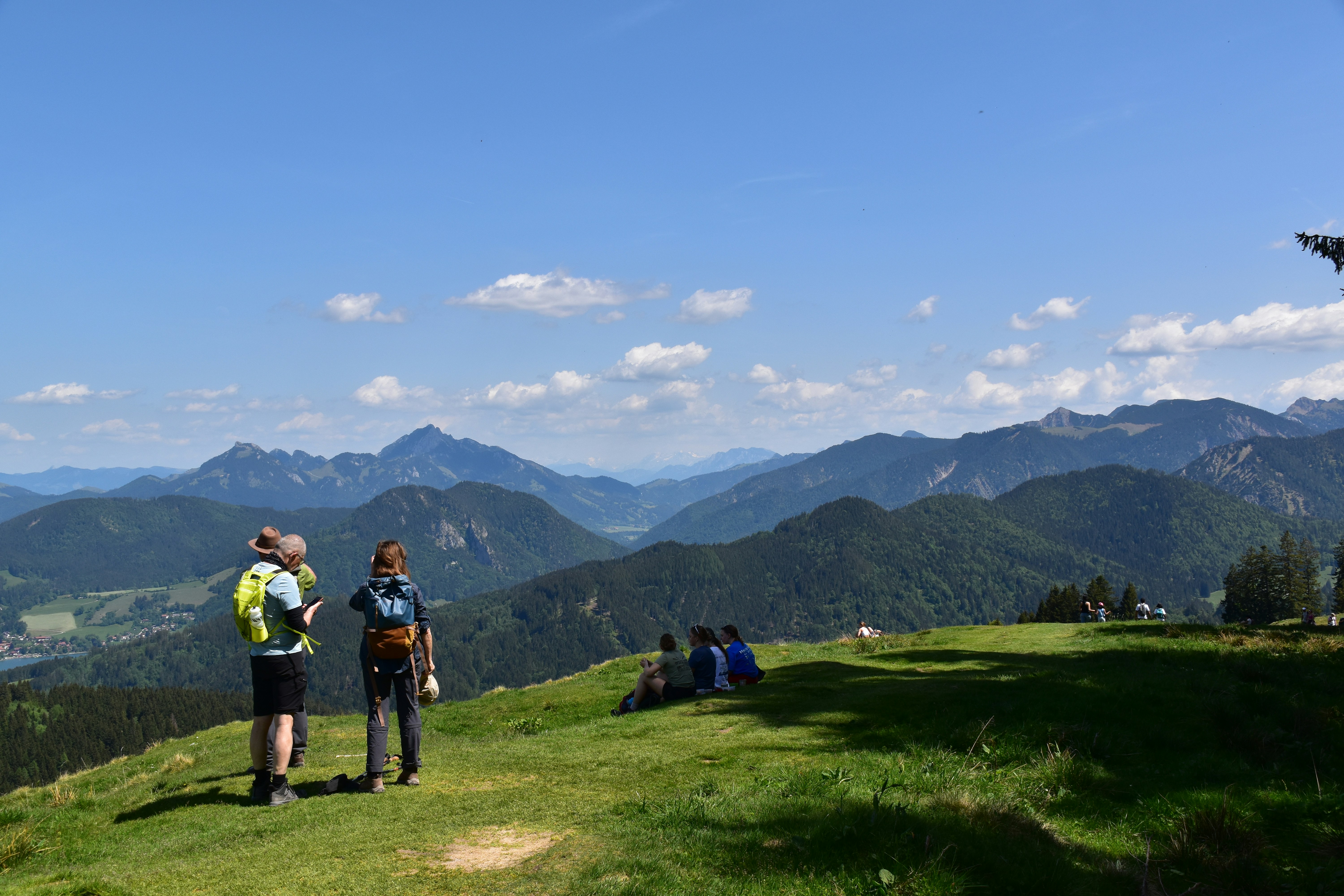 Hikers at a Mountain Vista: Valleys, Peaks, and Open Sky