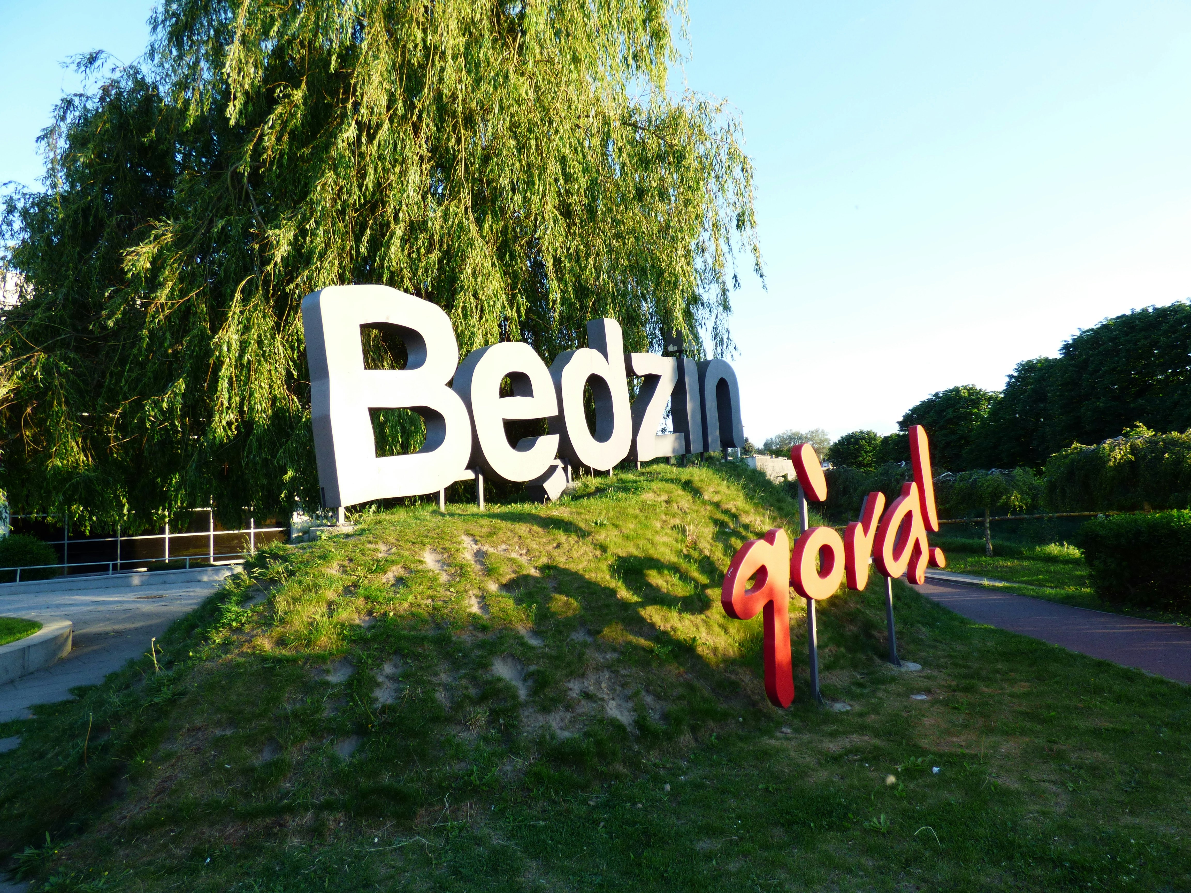 Bedzin Welcome Sign on a Sunlit Hill
