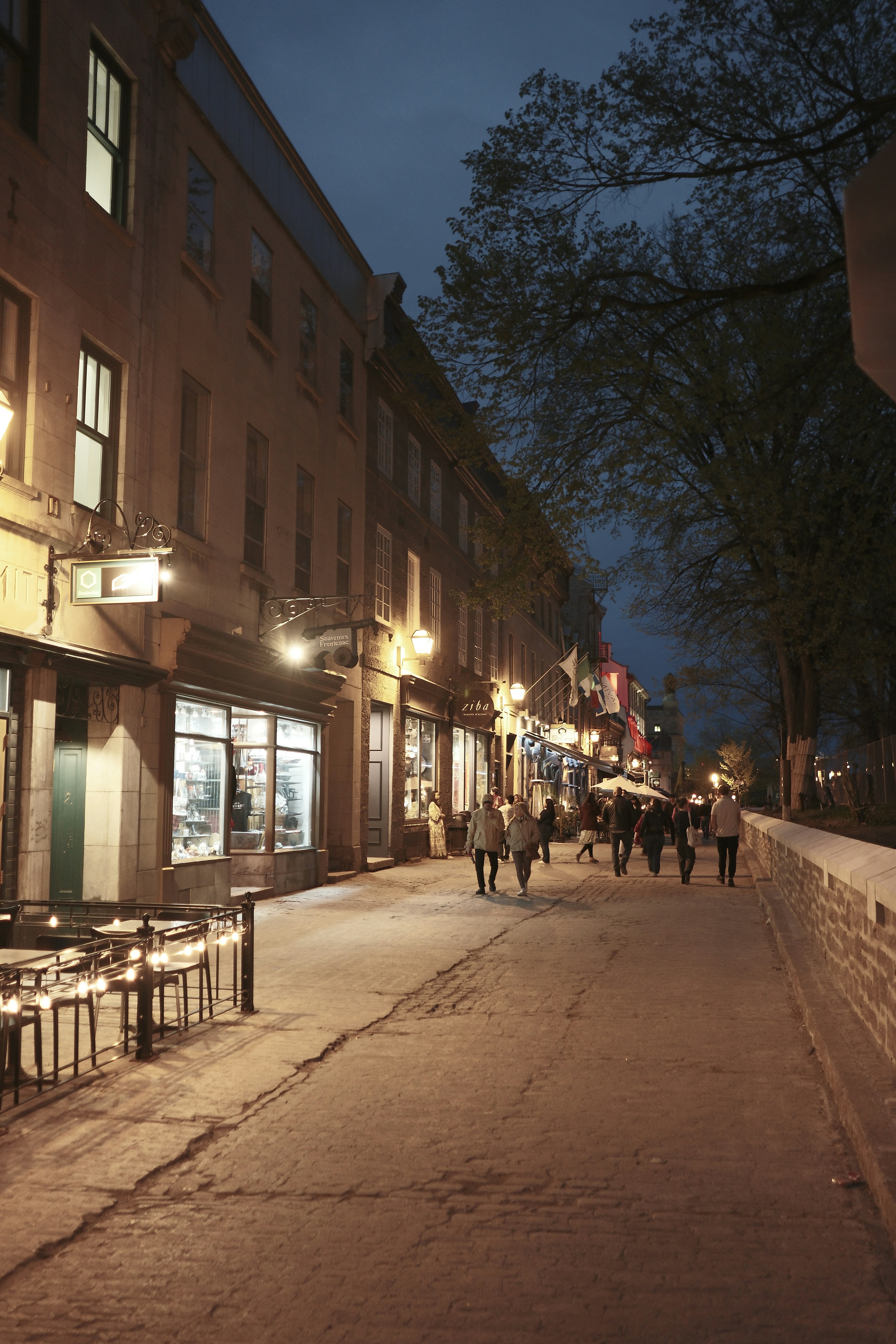 Lantern-lit Lane: Evening Stroll Along a Cobblestone Street