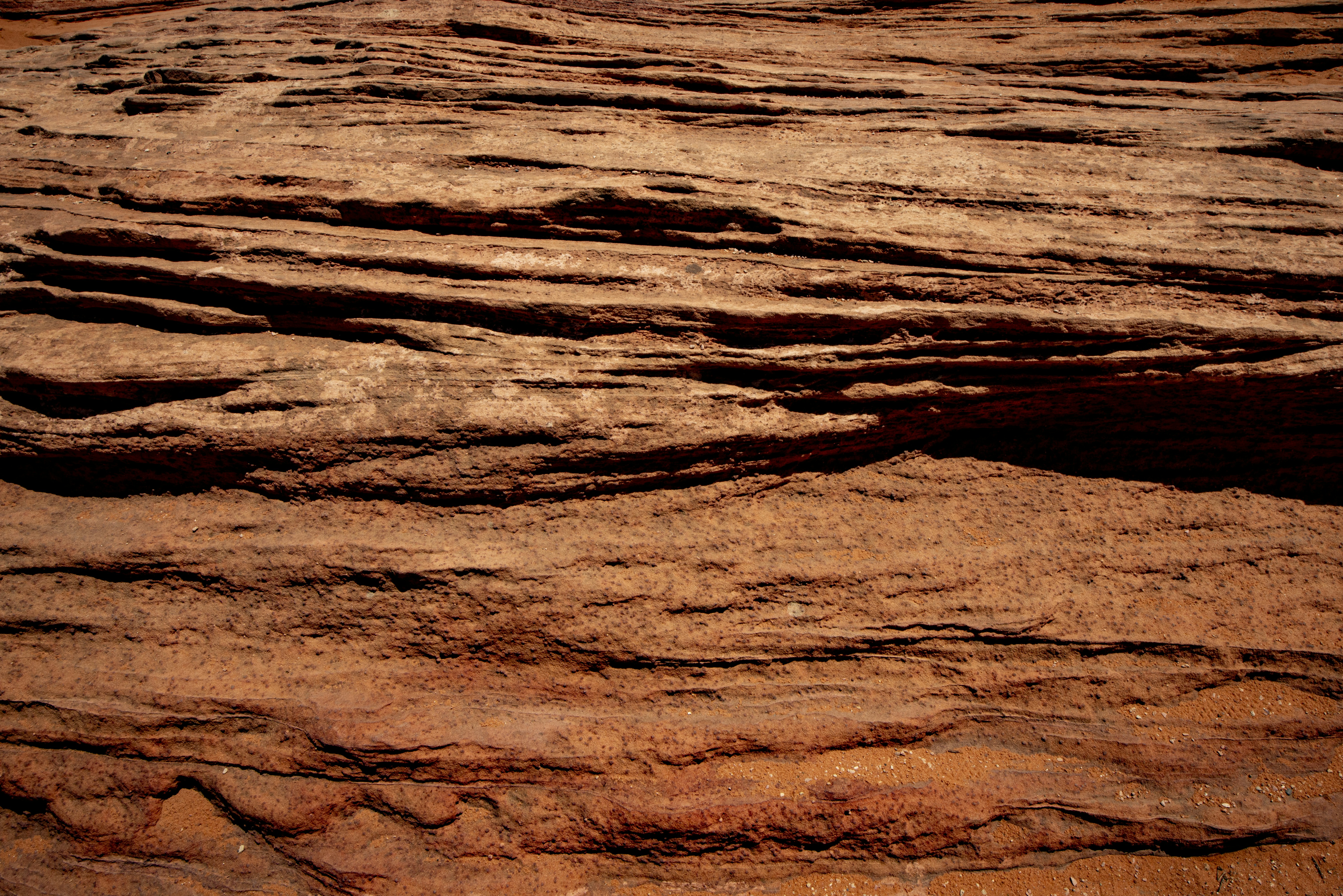 Deserted Terrains: Weathered Ridges in Rust-Red Stone