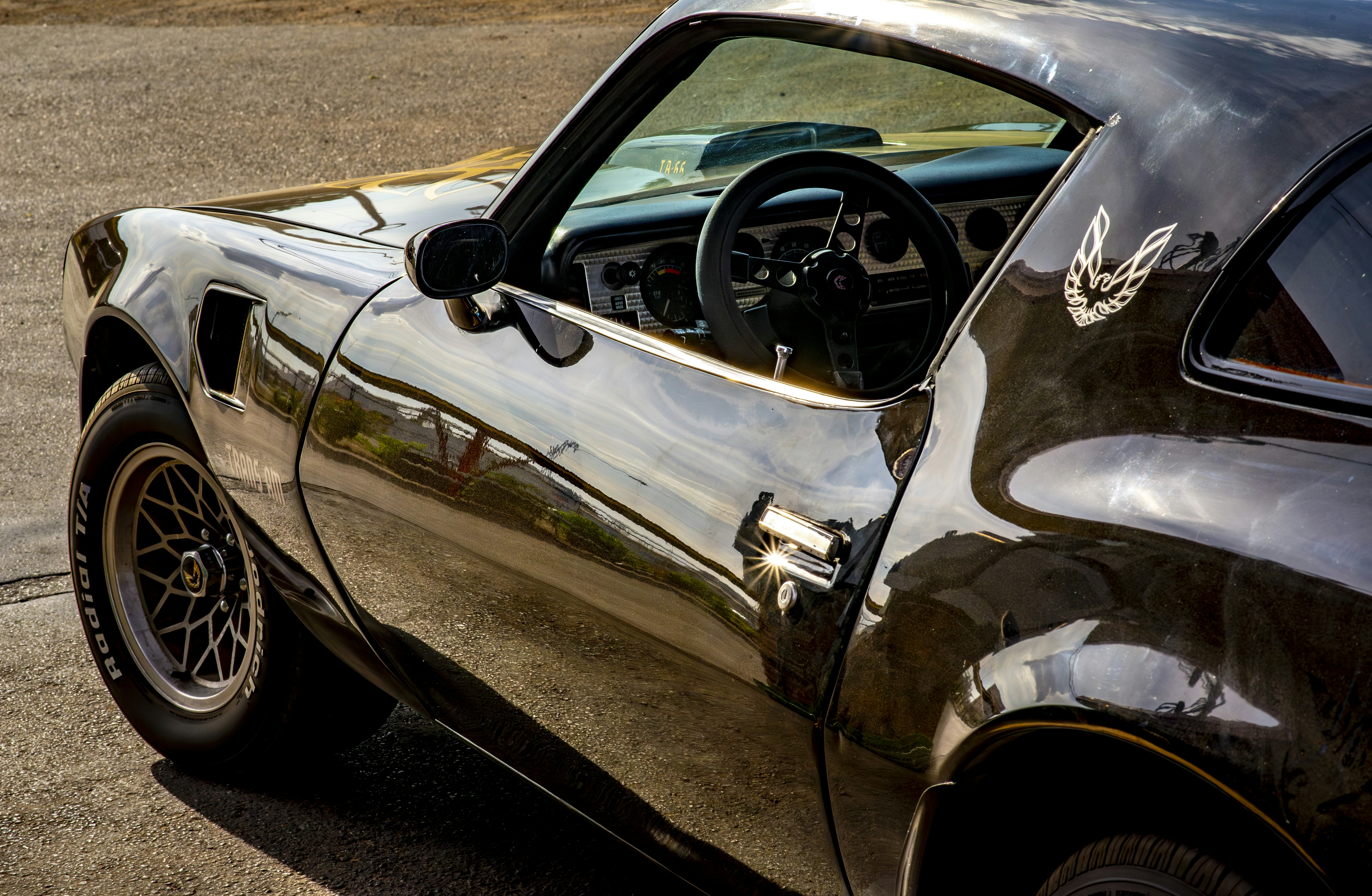 Shiny classic coupe: chrome reflections and vintage silhouette