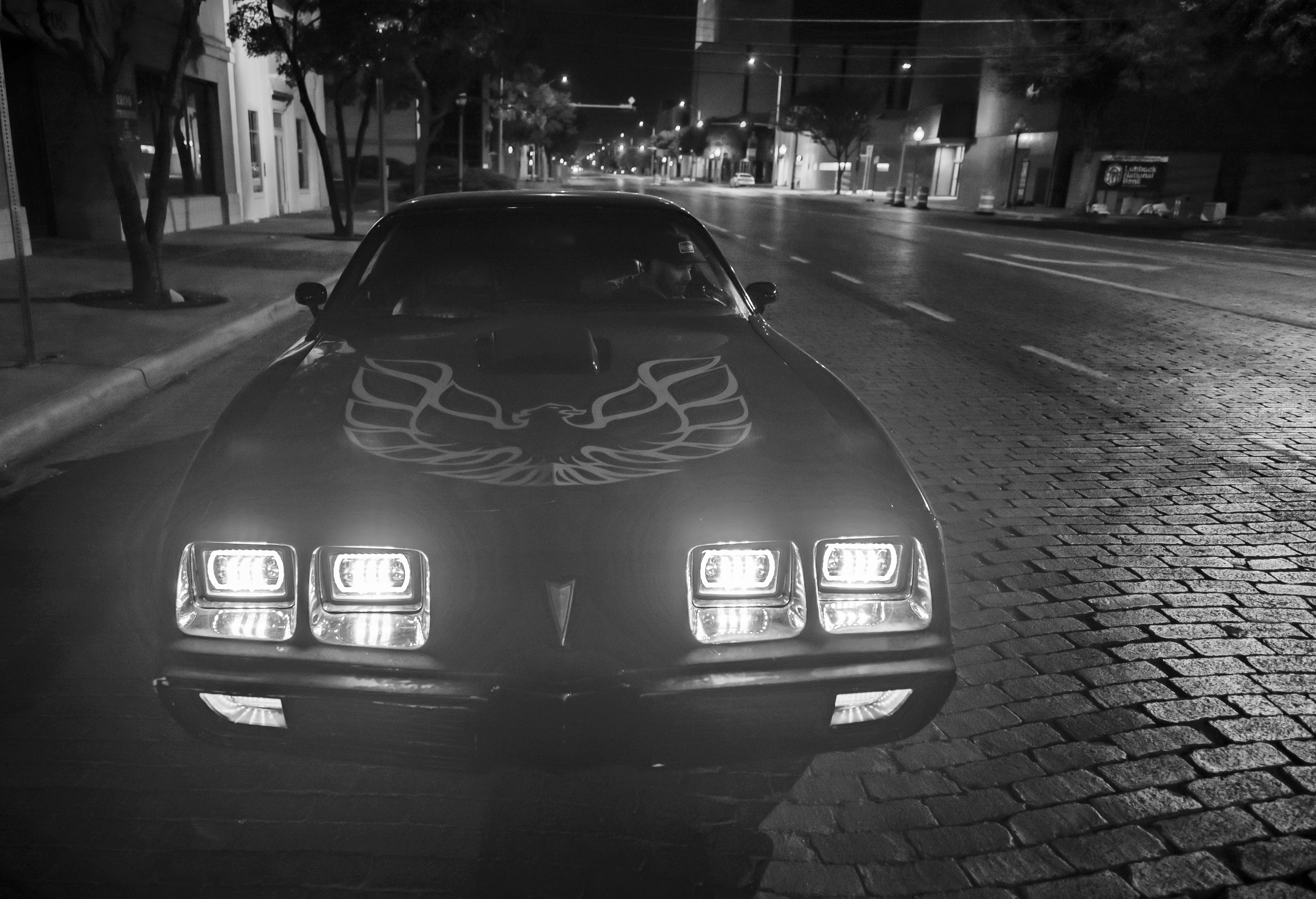 Street Crown: A Nighttime Muscle Car under City Lights