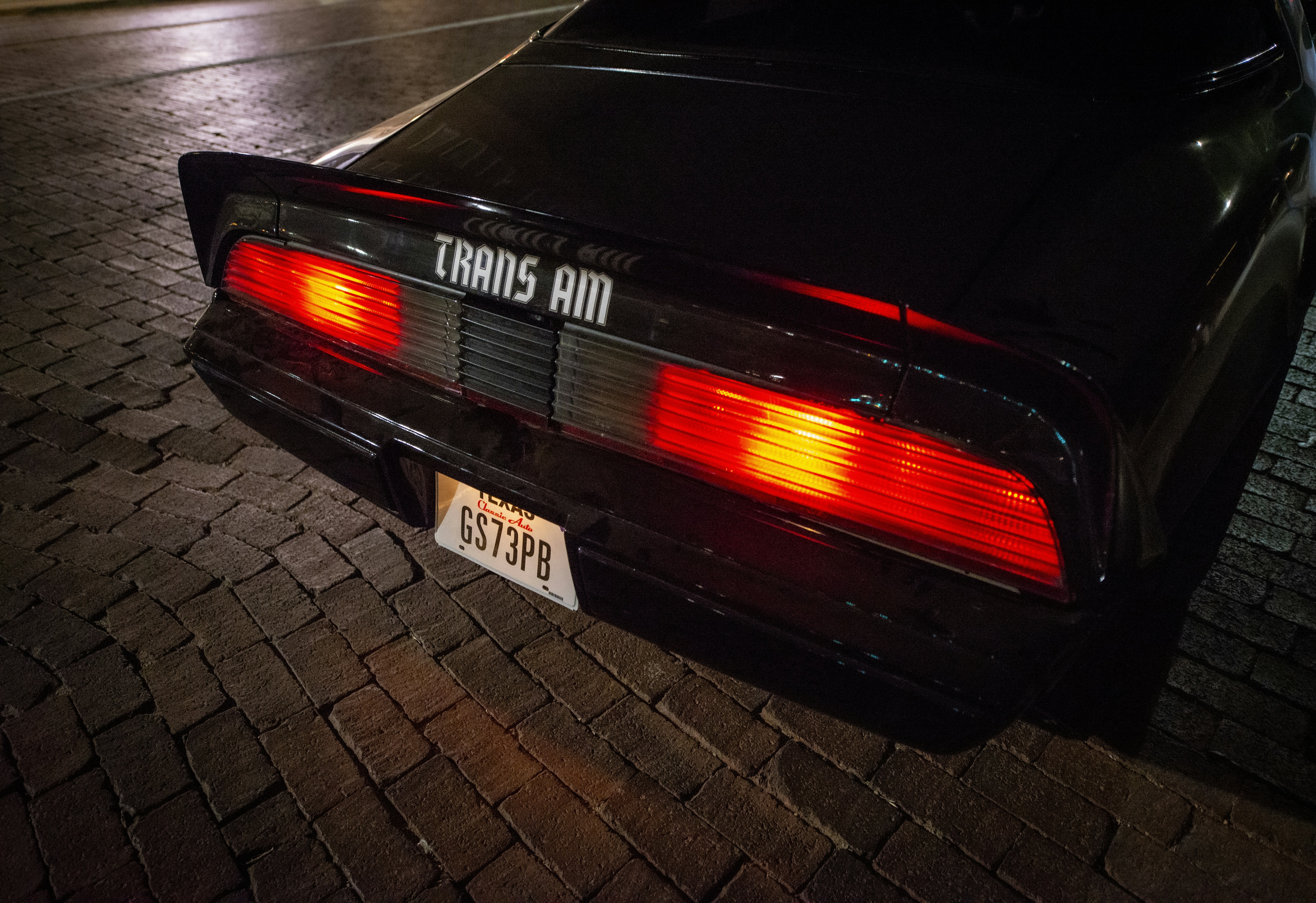 Tail Light Echoes: A Retro Trans Am at Night
