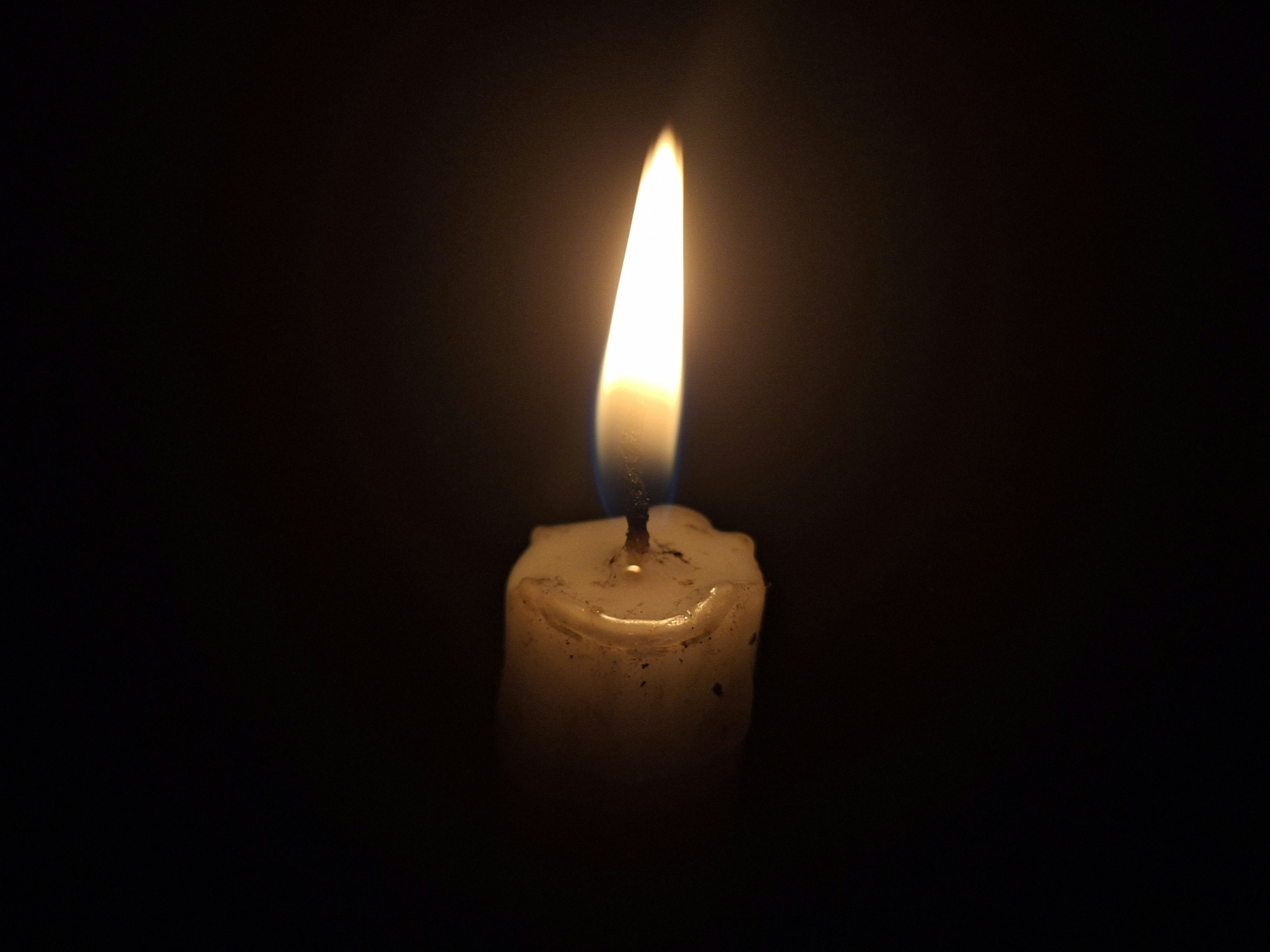 Single Flame in the Dark: A Candle's Quiet Resolve