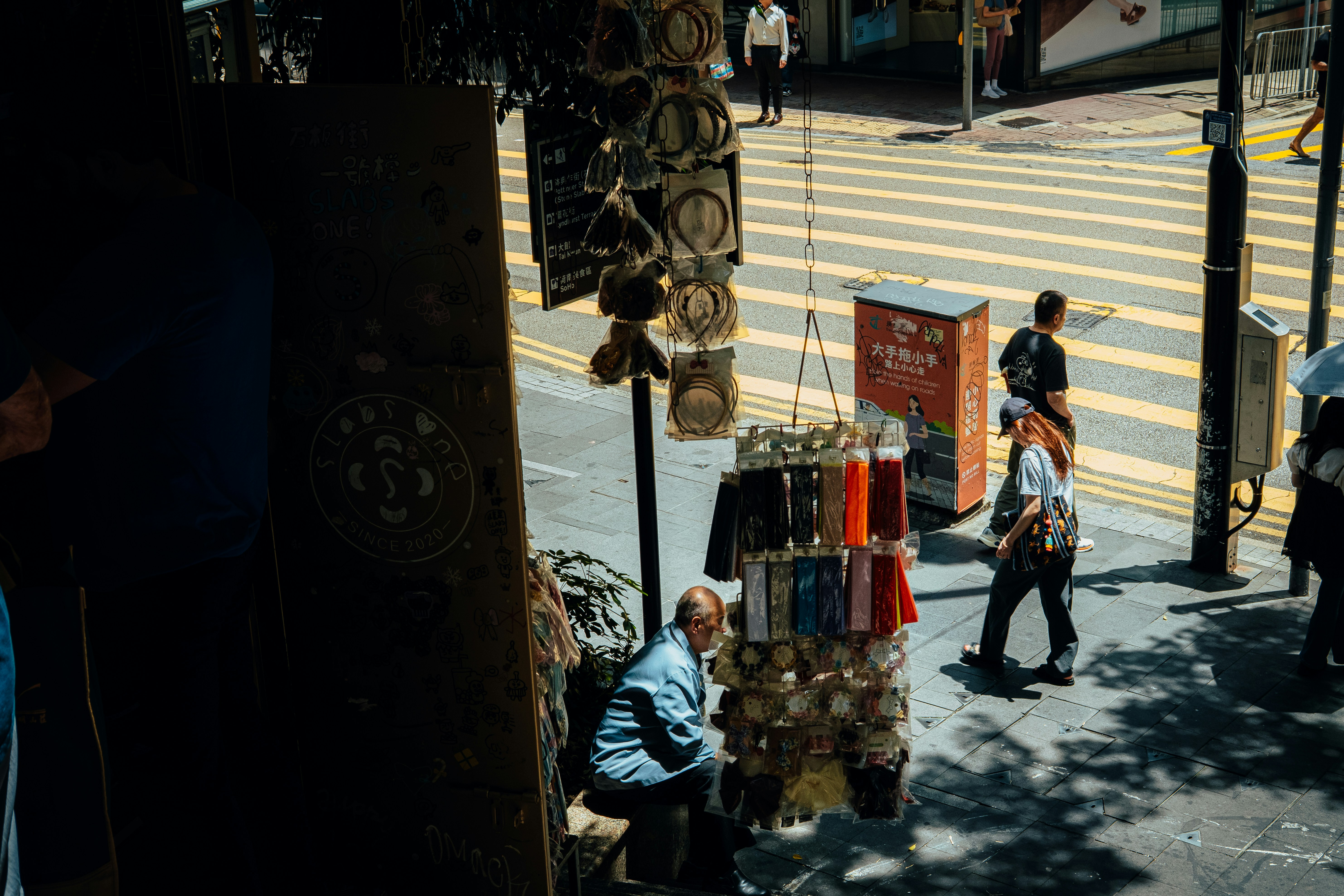 Sidewalk Market Stall Under Dappled Light