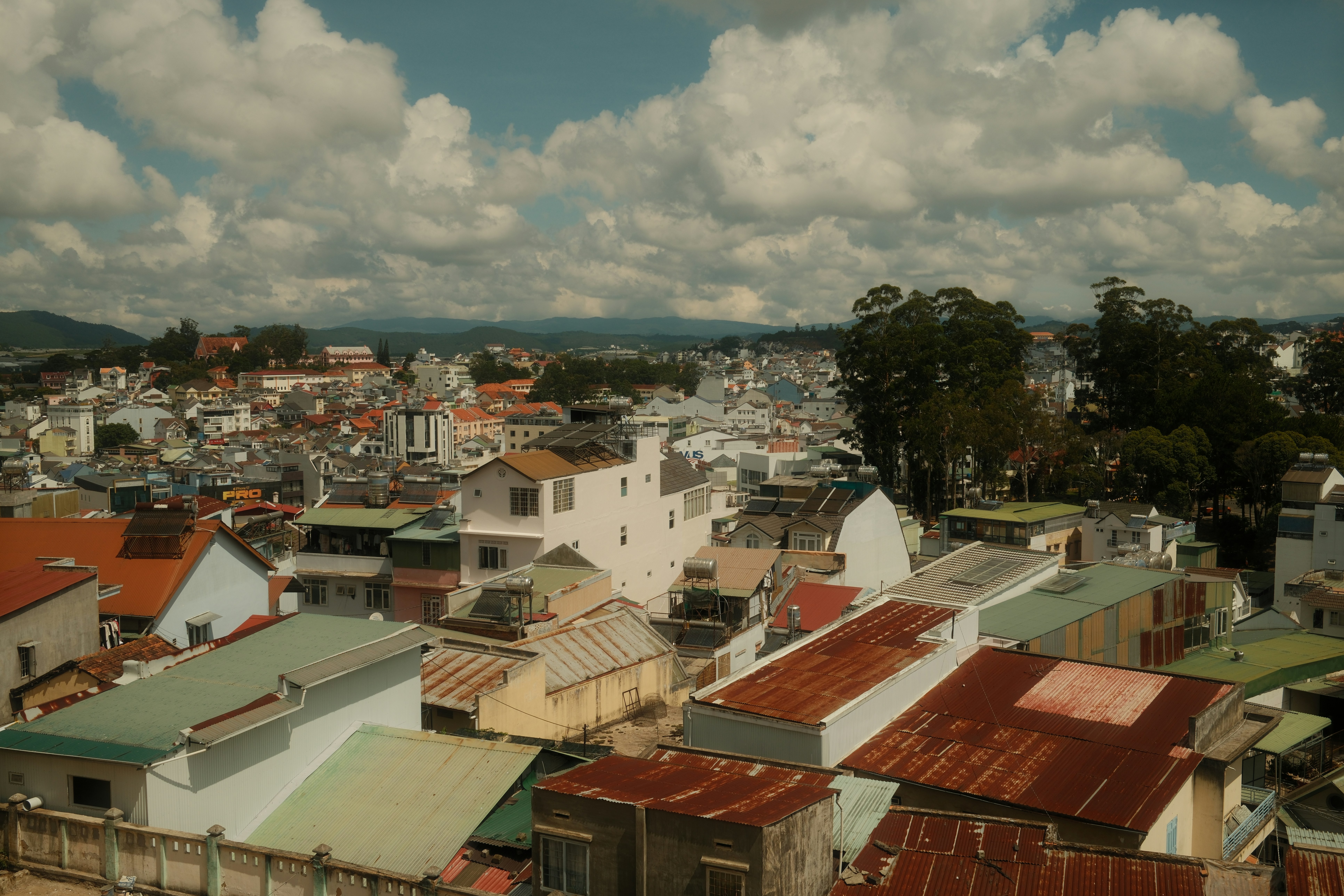 Rooftops under a Patchwork Sky