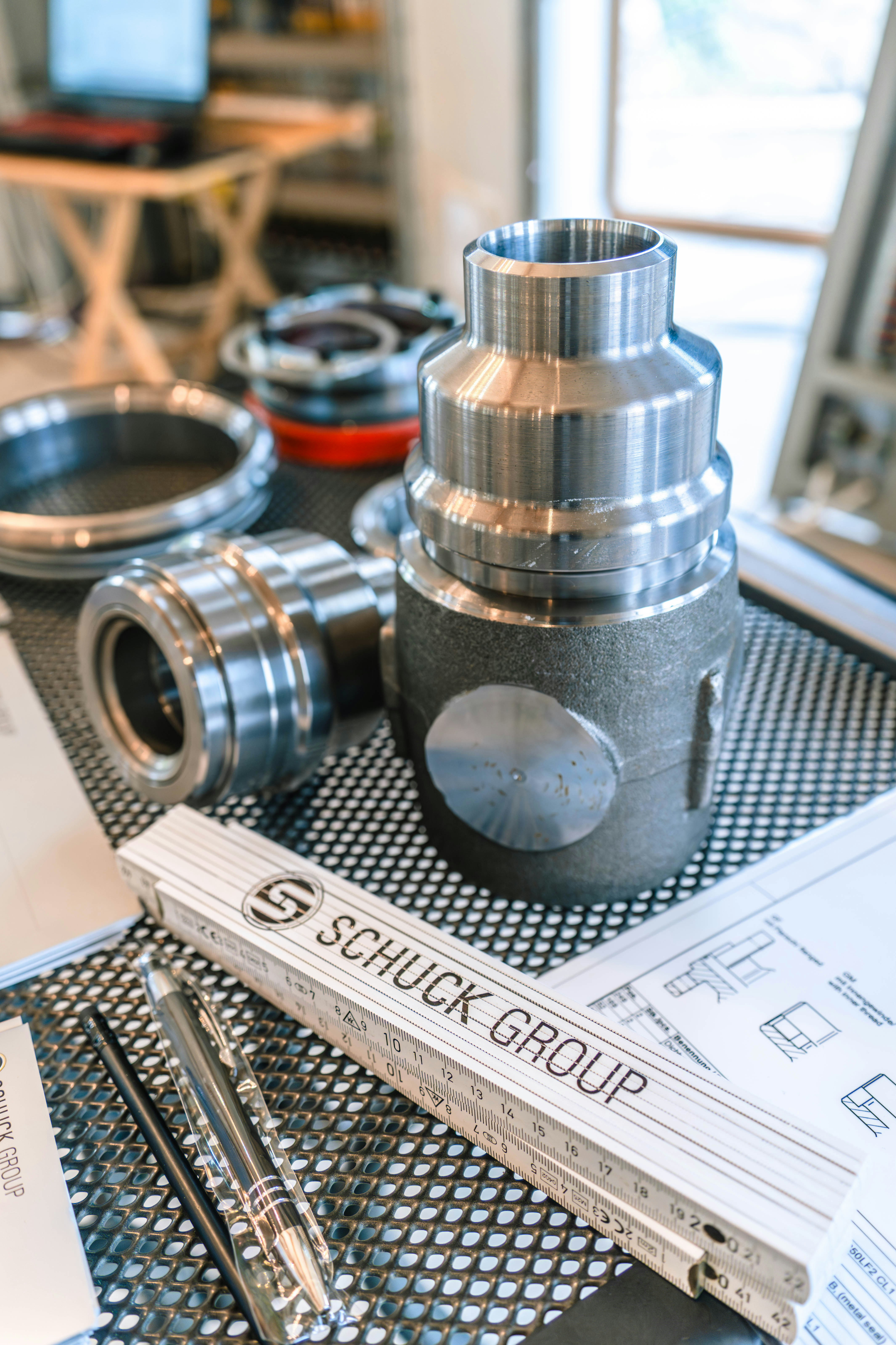 Machined Precision: A Workspace of Cylinders and Drawings