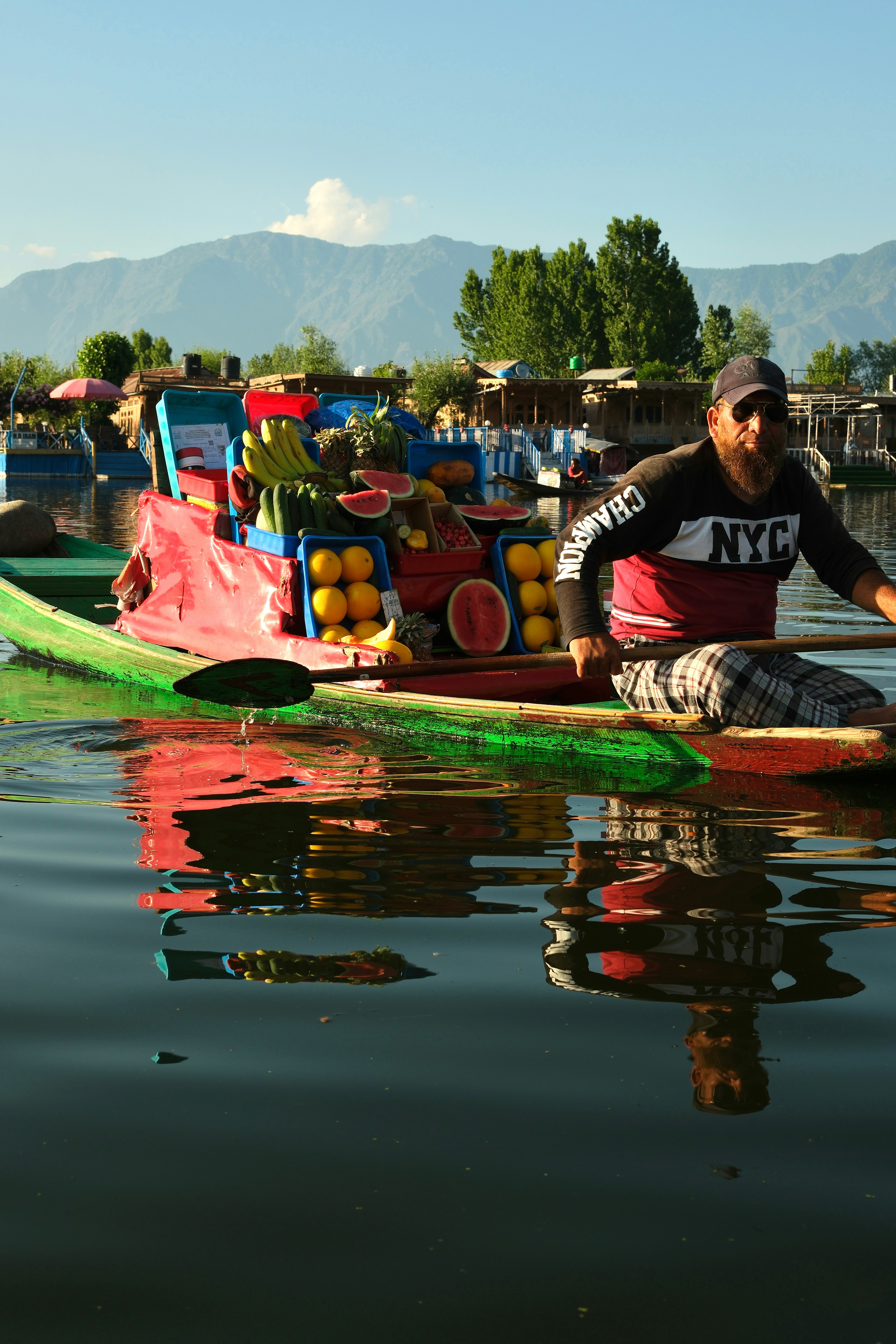 Fruit Boat and Bearded Vendor: Harbor Life in the Distance