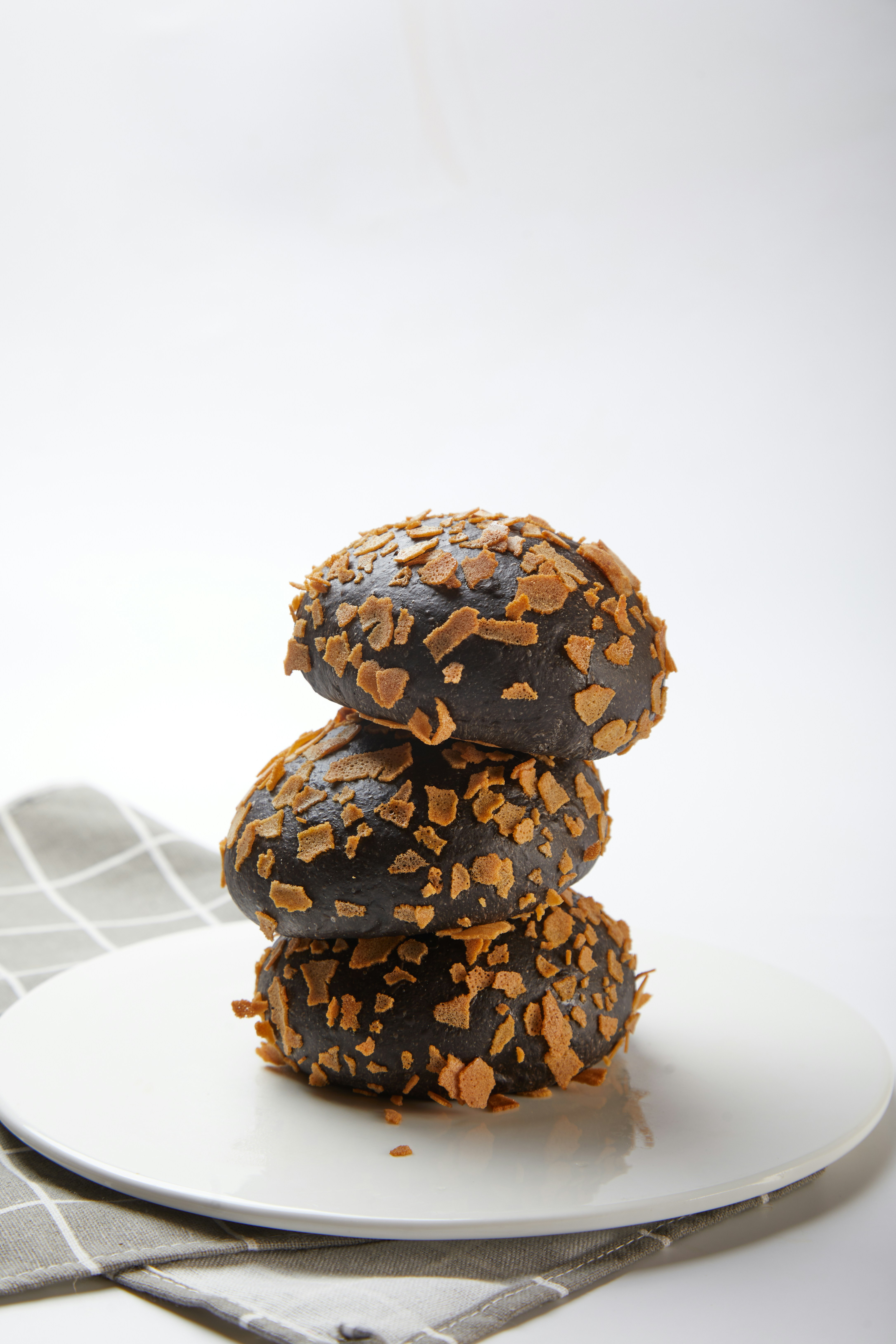 Stacked Treats in Velvet Chocolate: Crumbs on a White Plate