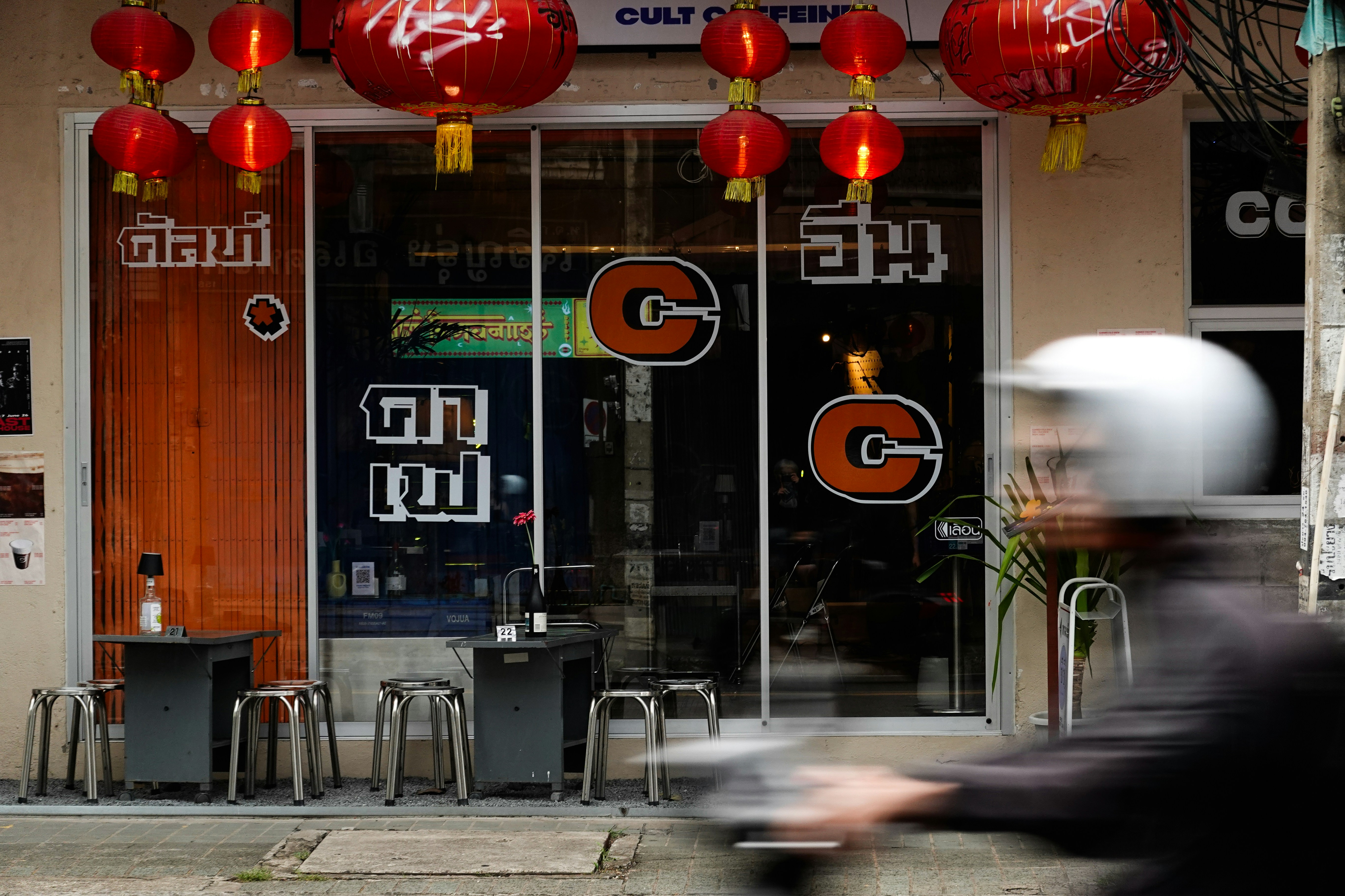 Floating Neon and Blurred Motion: A Street-Level Shopfront in Motion
