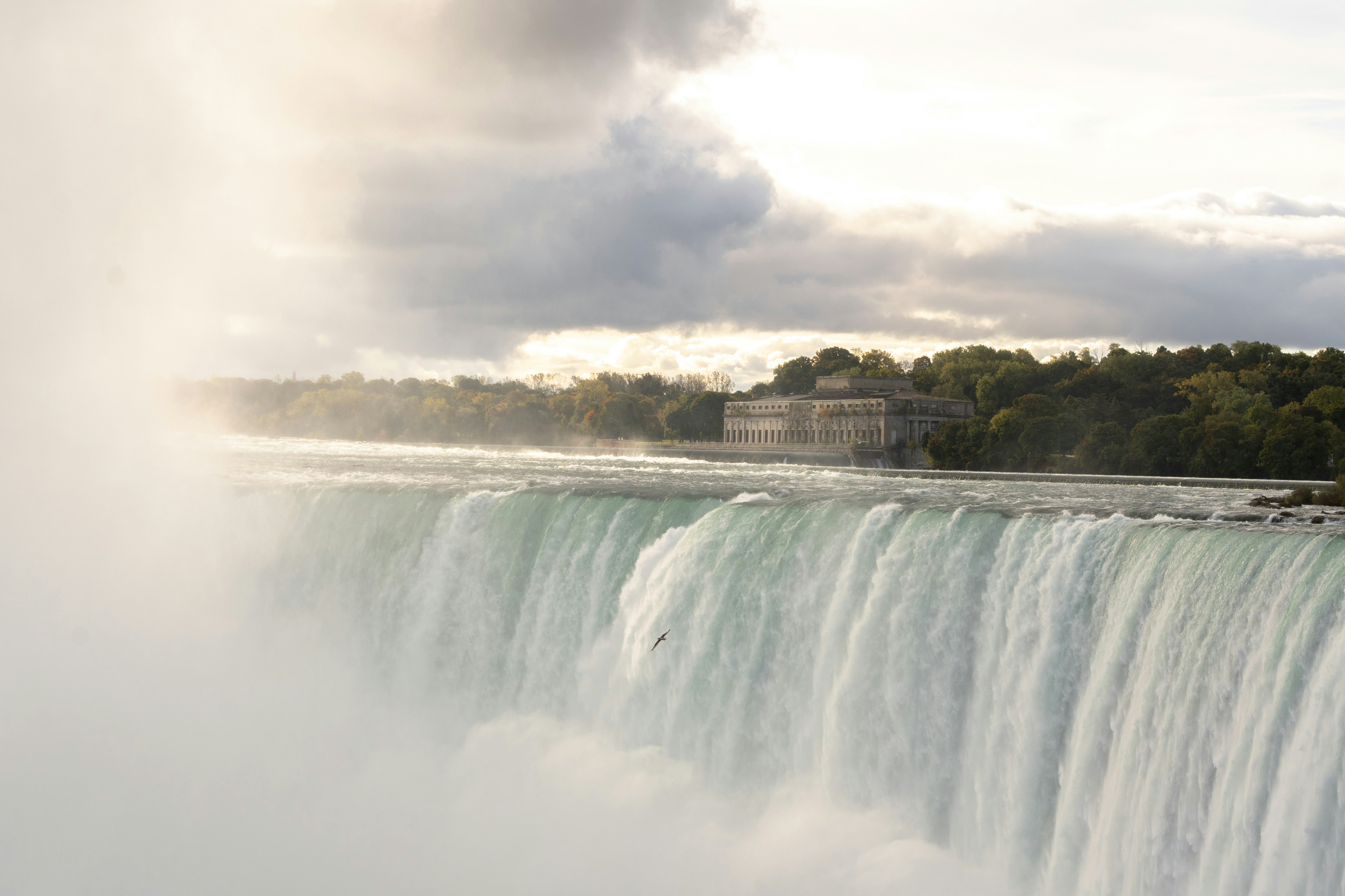 Mist Over the Cascade: A Quiet Vista Beyond the Waterfall