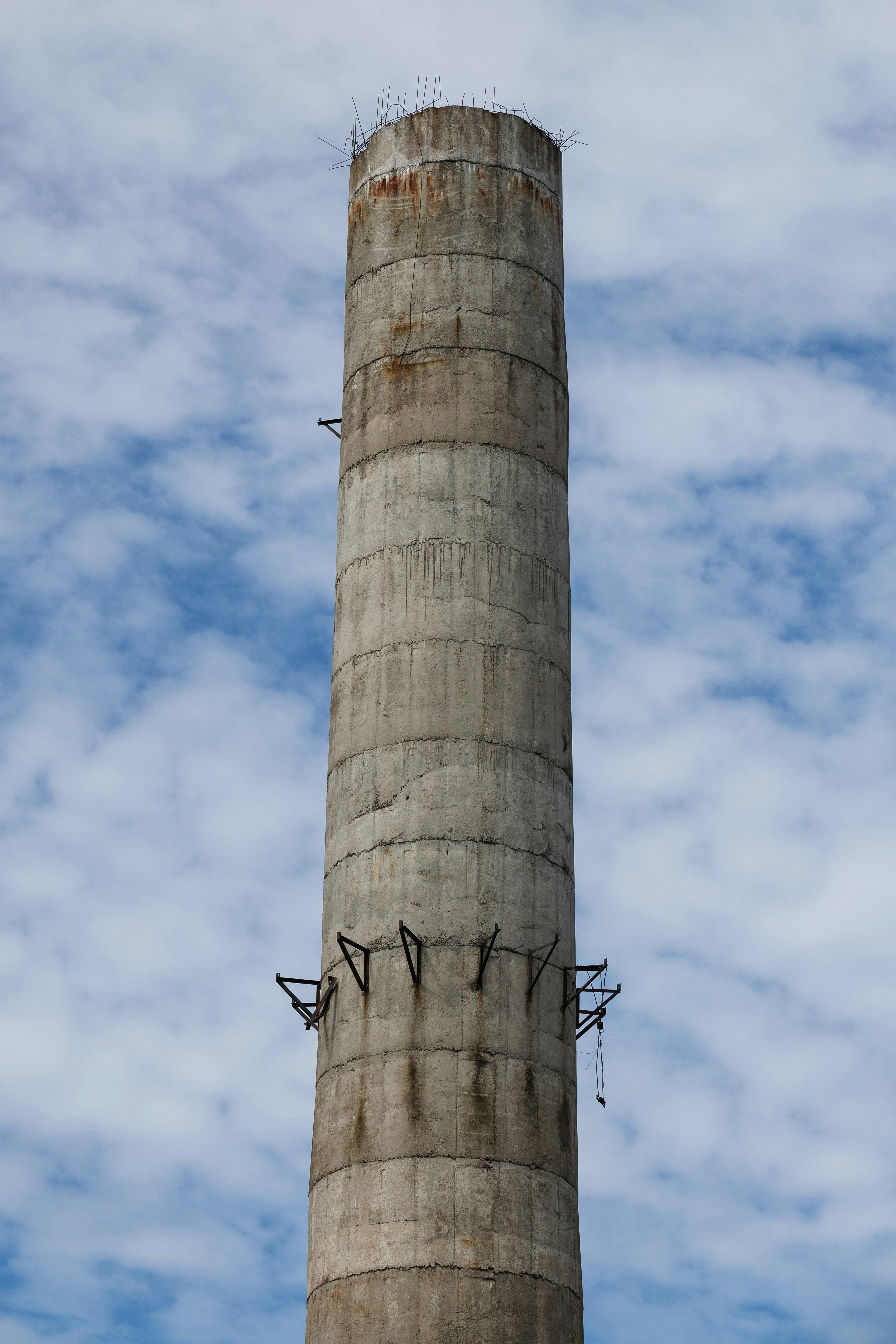 Monolithic Chimney Reaching Toward a Sky-swept Stratus
