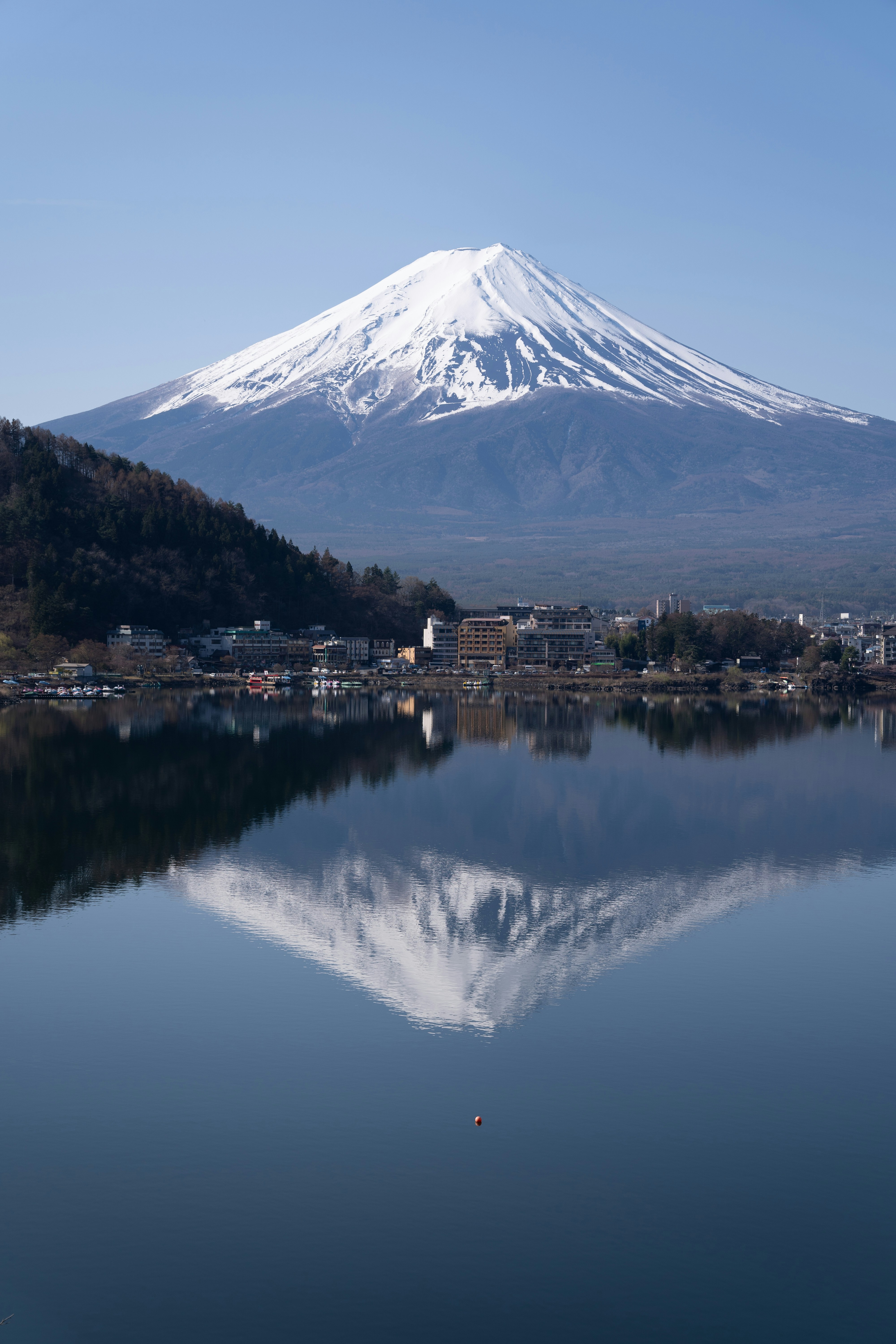 Snow-capped Fuji Rising over a Quiet Lake Town