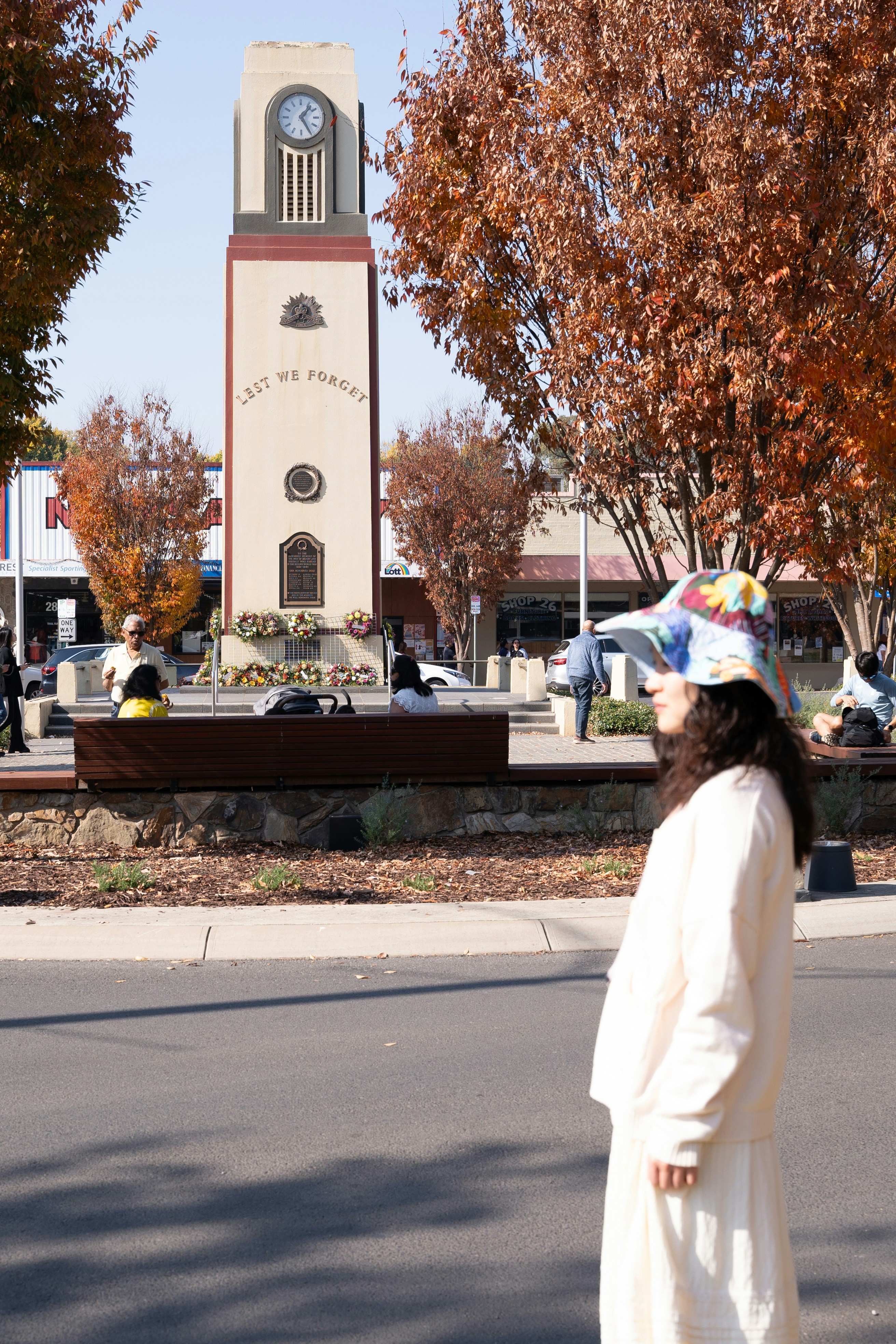 Currents of Color and Calm: A Street Portrait by the Clock Tower