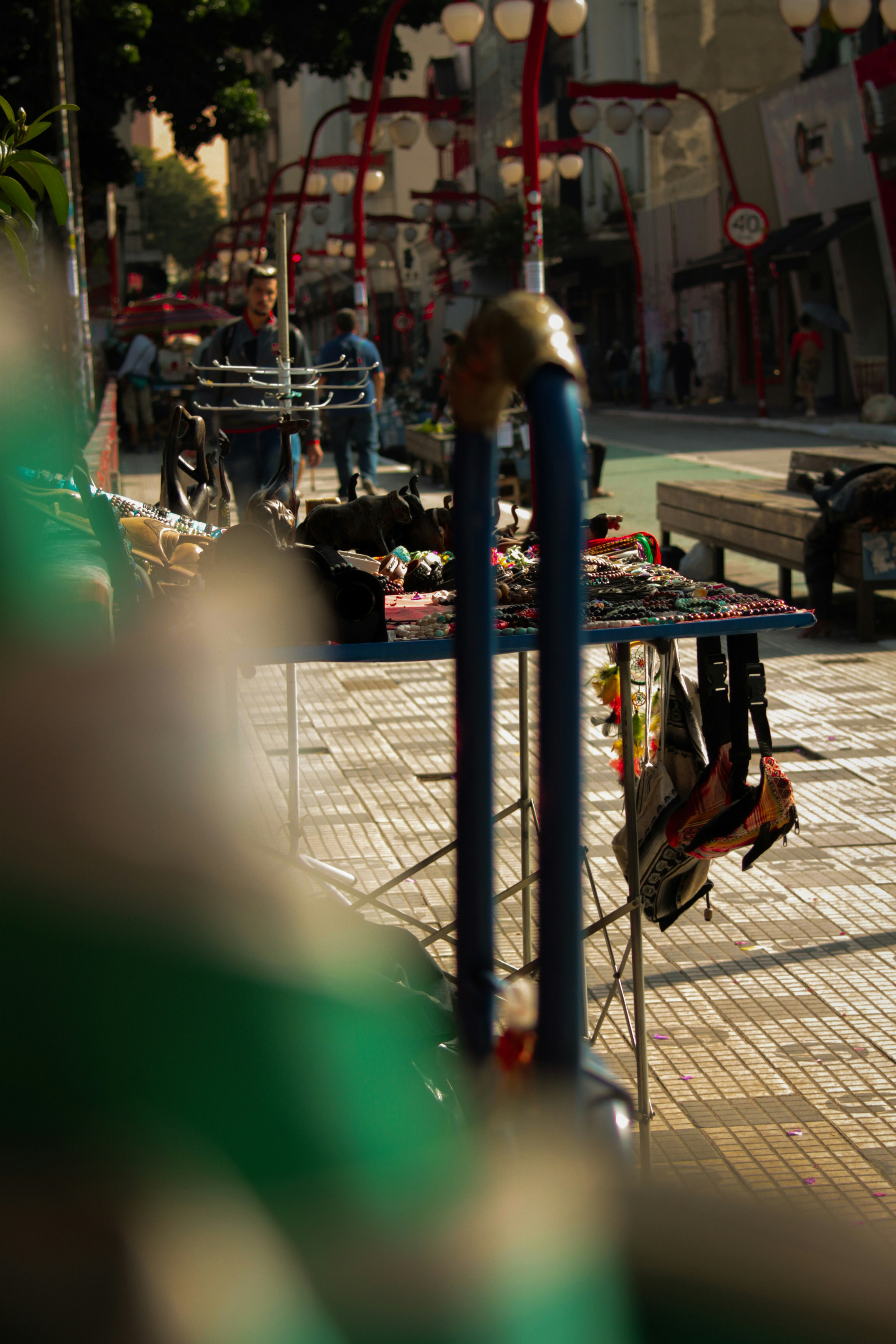 Street Vendor Stalls Framed by Urban Arcades