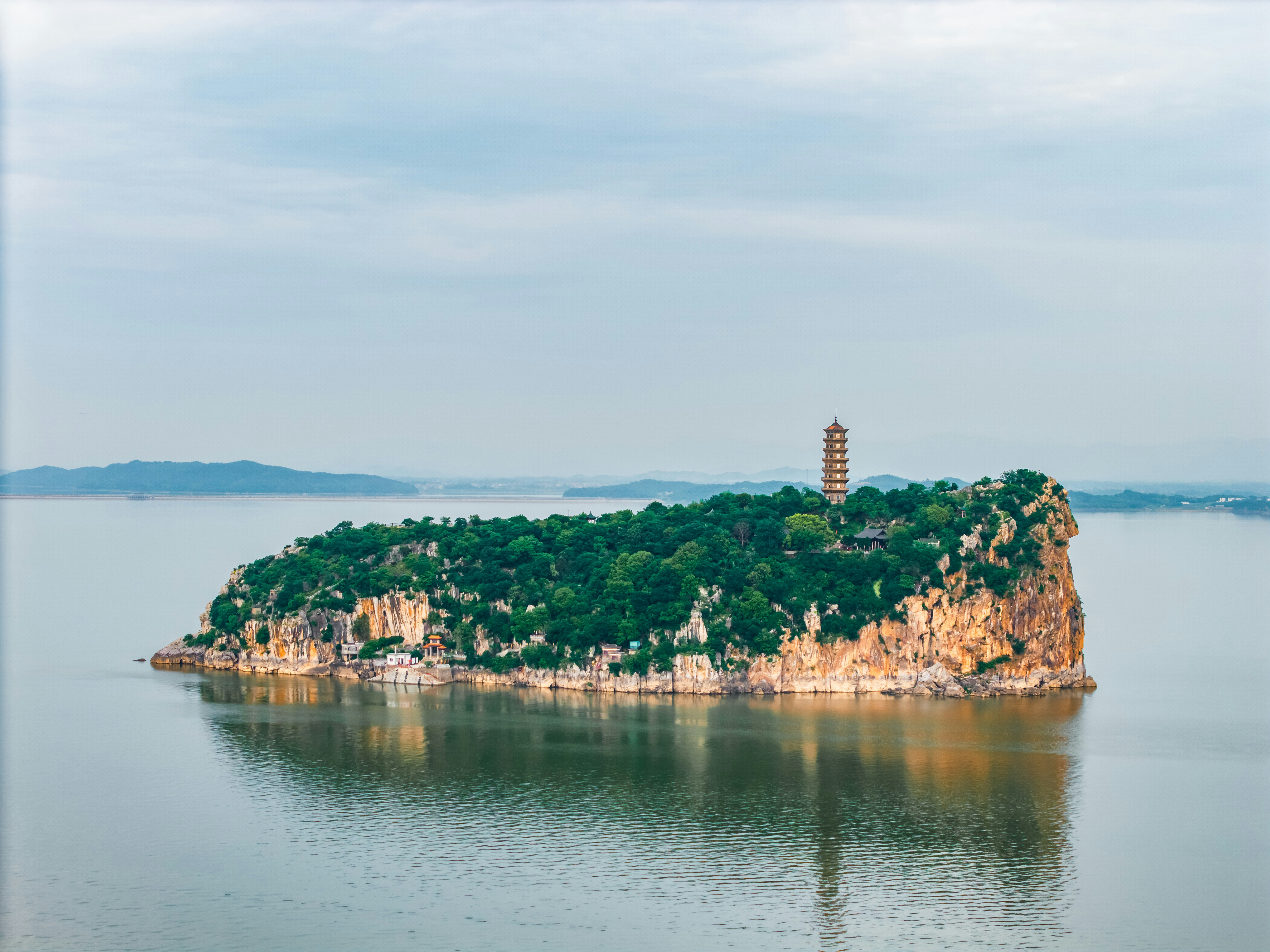Island Shrine: A Pagoda Crowned by Pines Rising from Calm Waters