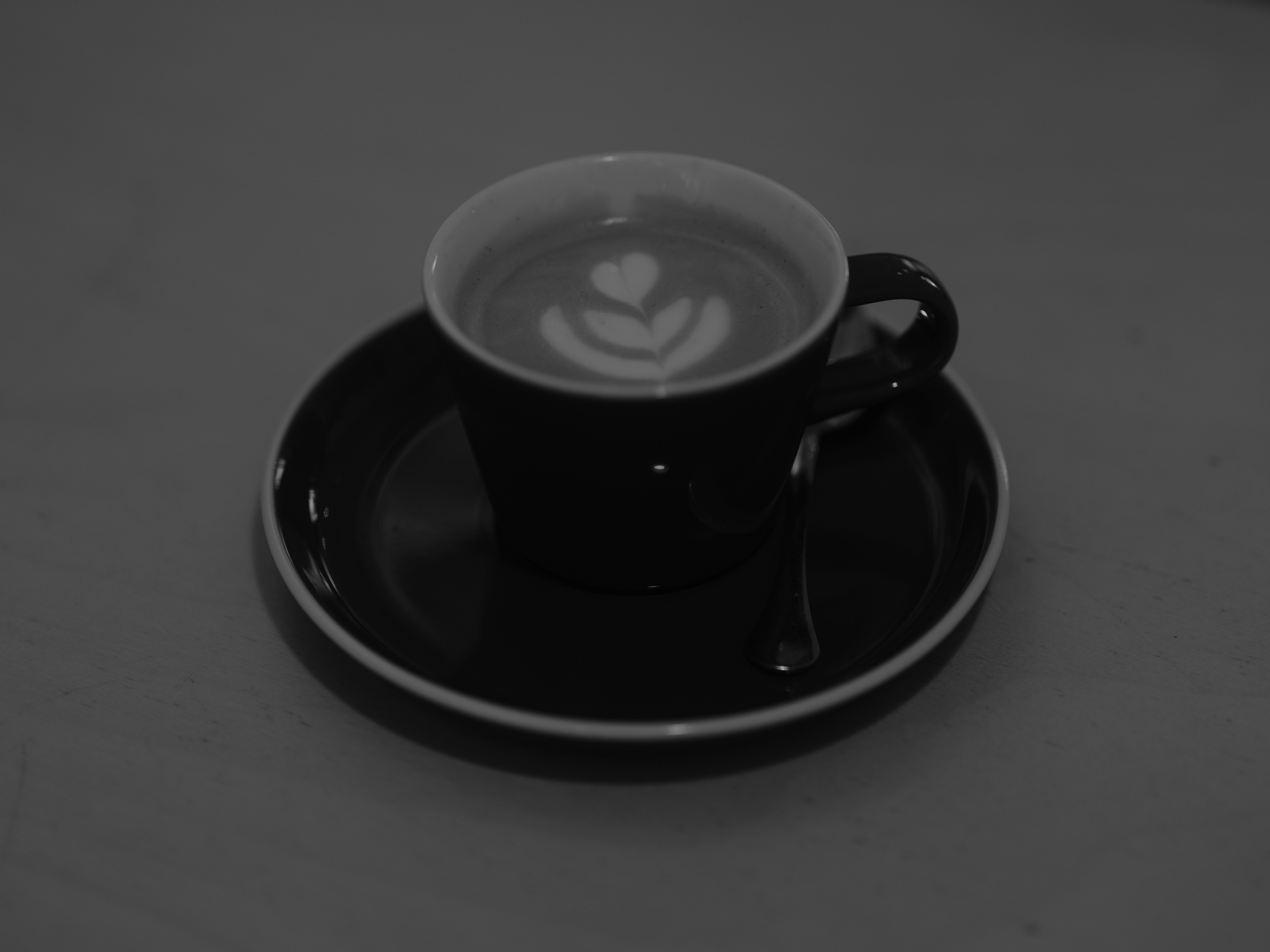 Centered Latte Bloom in a Dark Cup