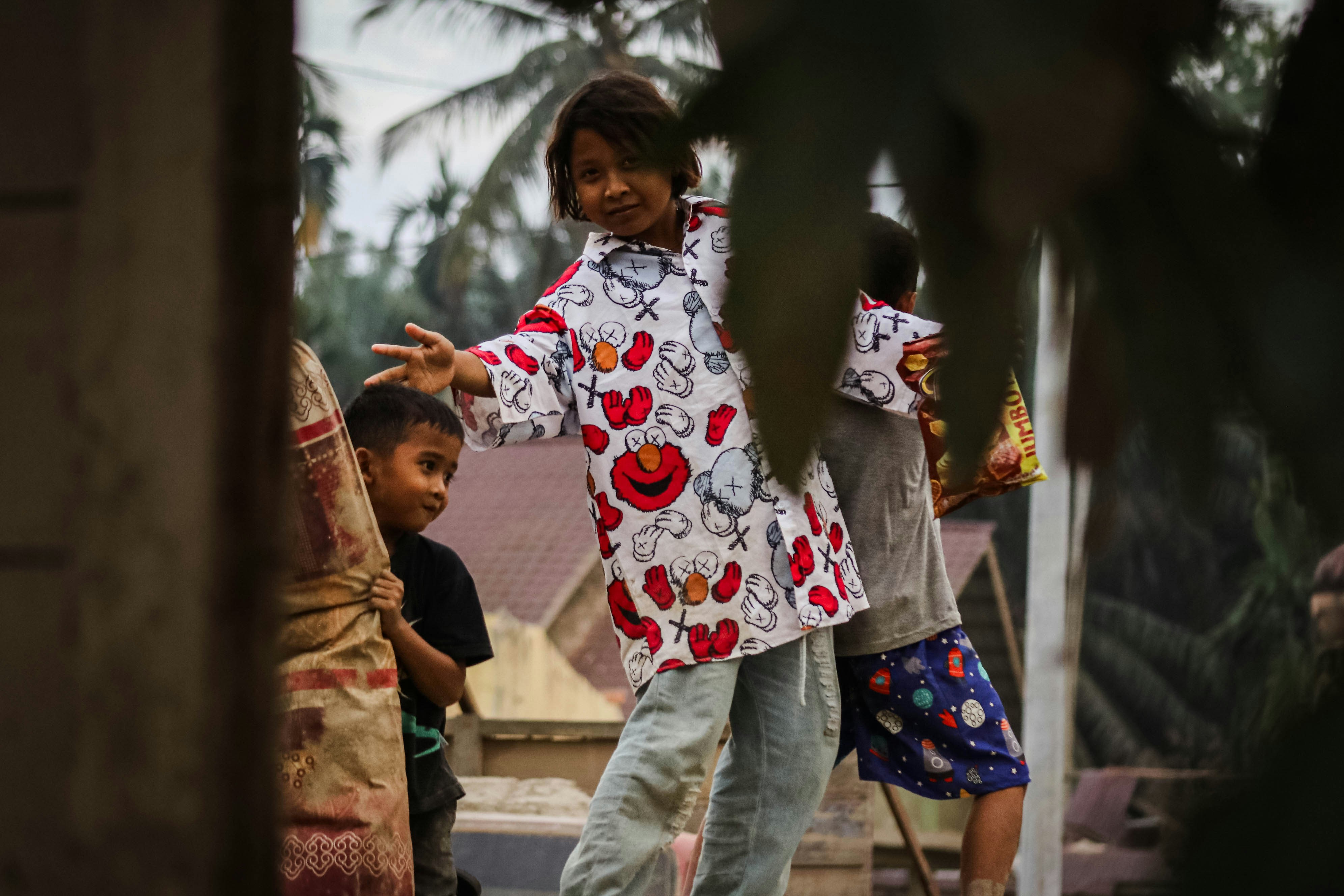 Joyful Leap: A Child's Playful Rally in the Backyard