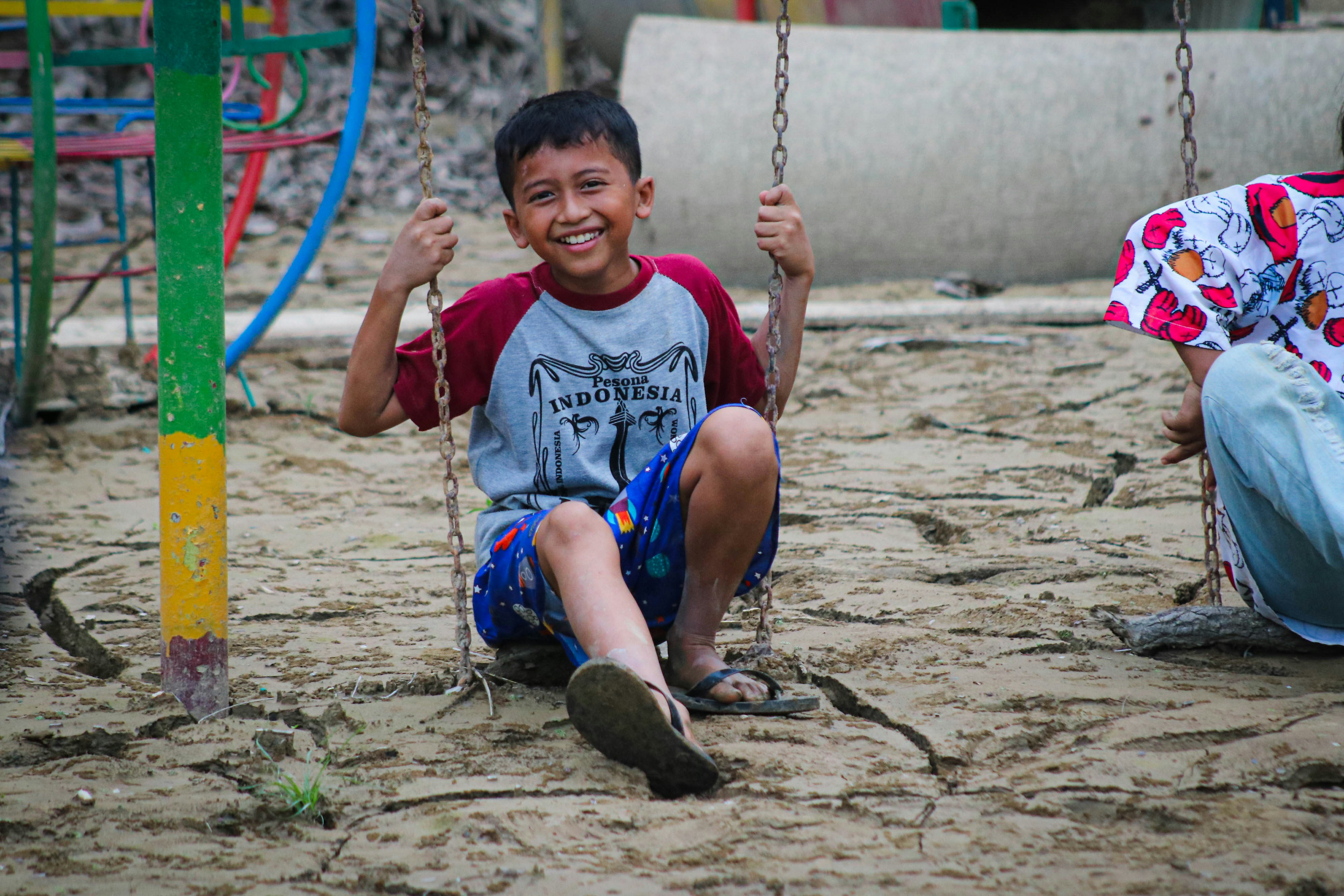 Smiles on the Swing: A Child's Sandbox of Light
