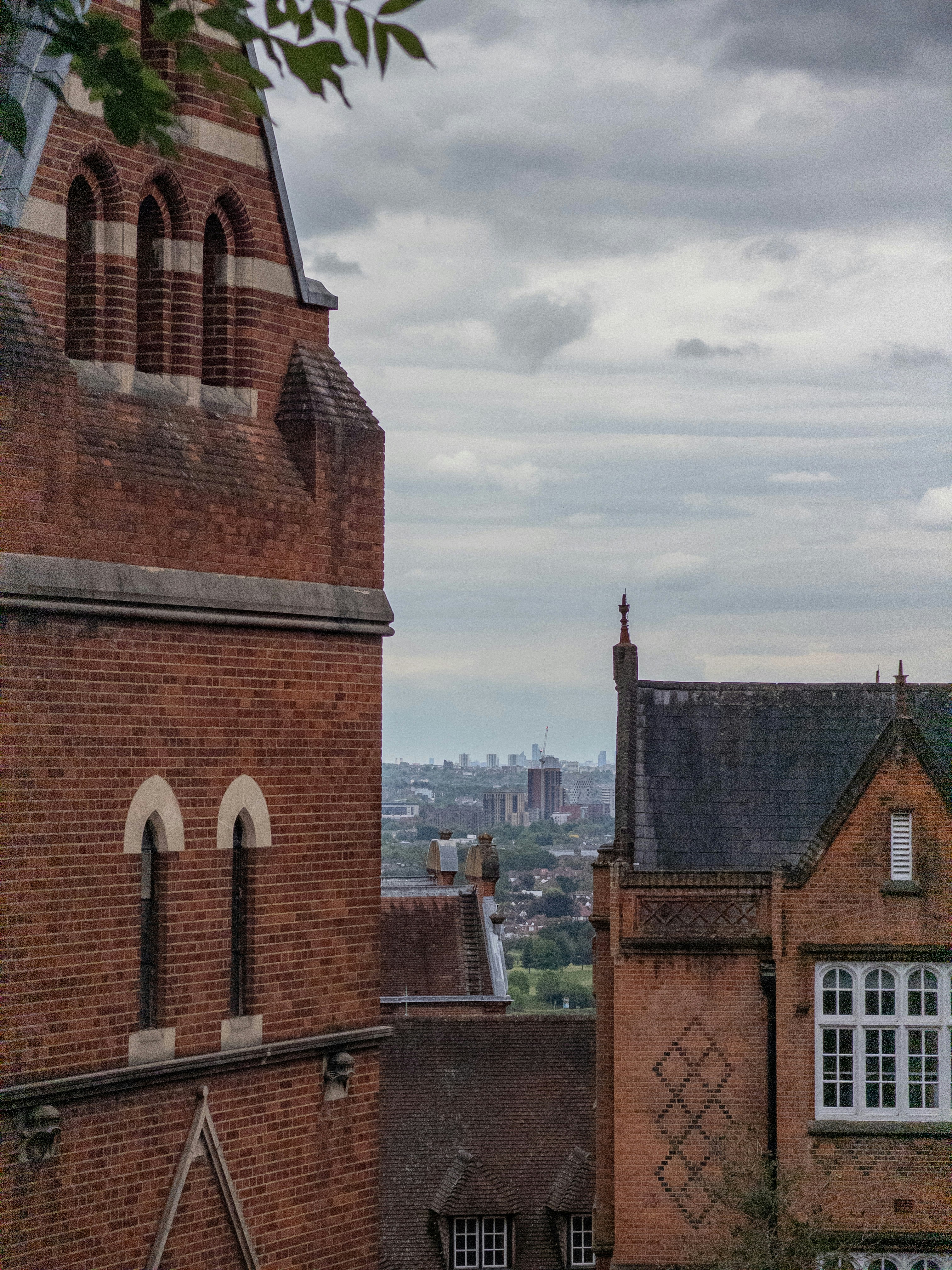 Brick Cathedral and Rooftops: A Quiet City Skyline