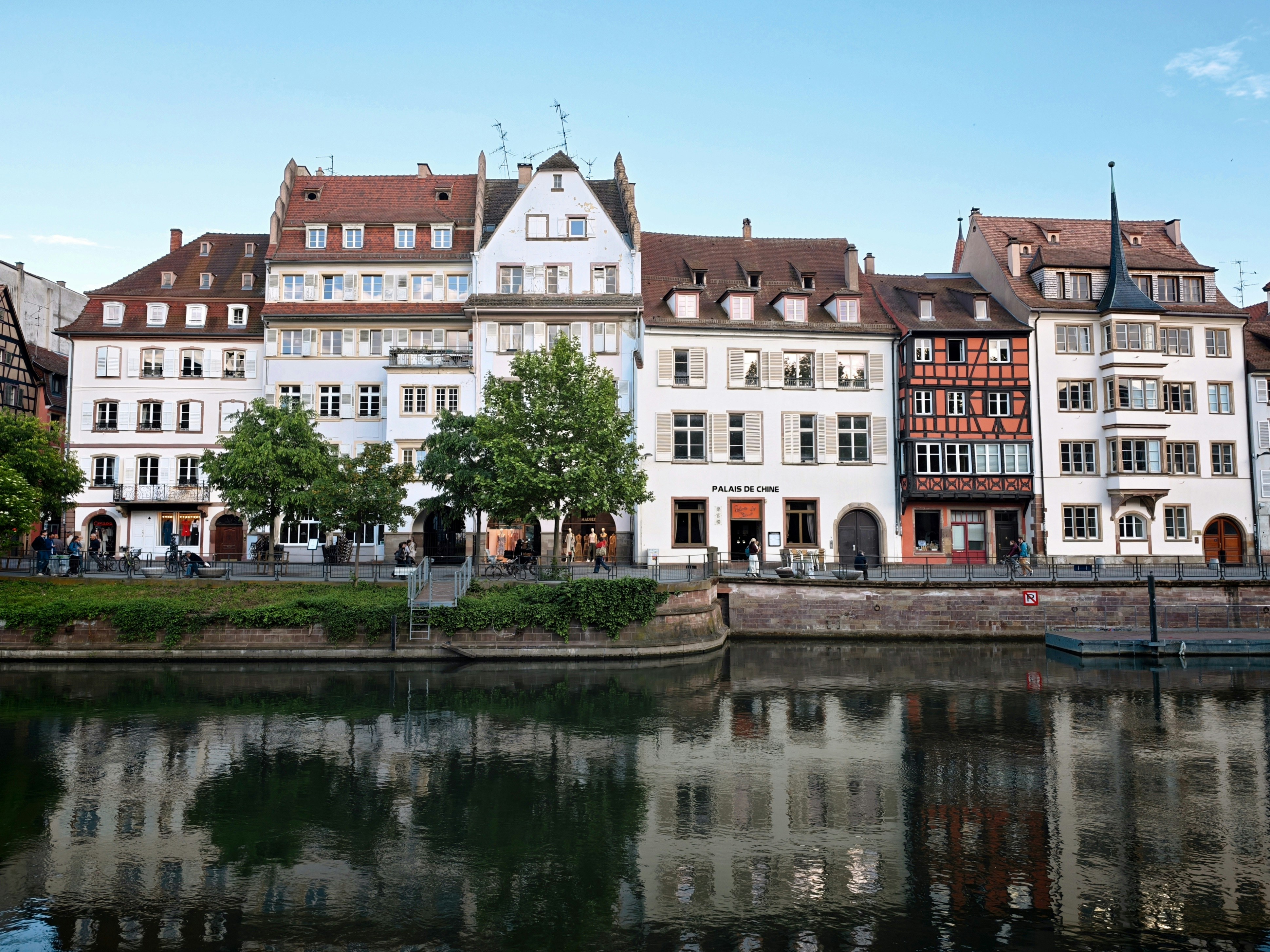 Row of timbered facades along the canal
