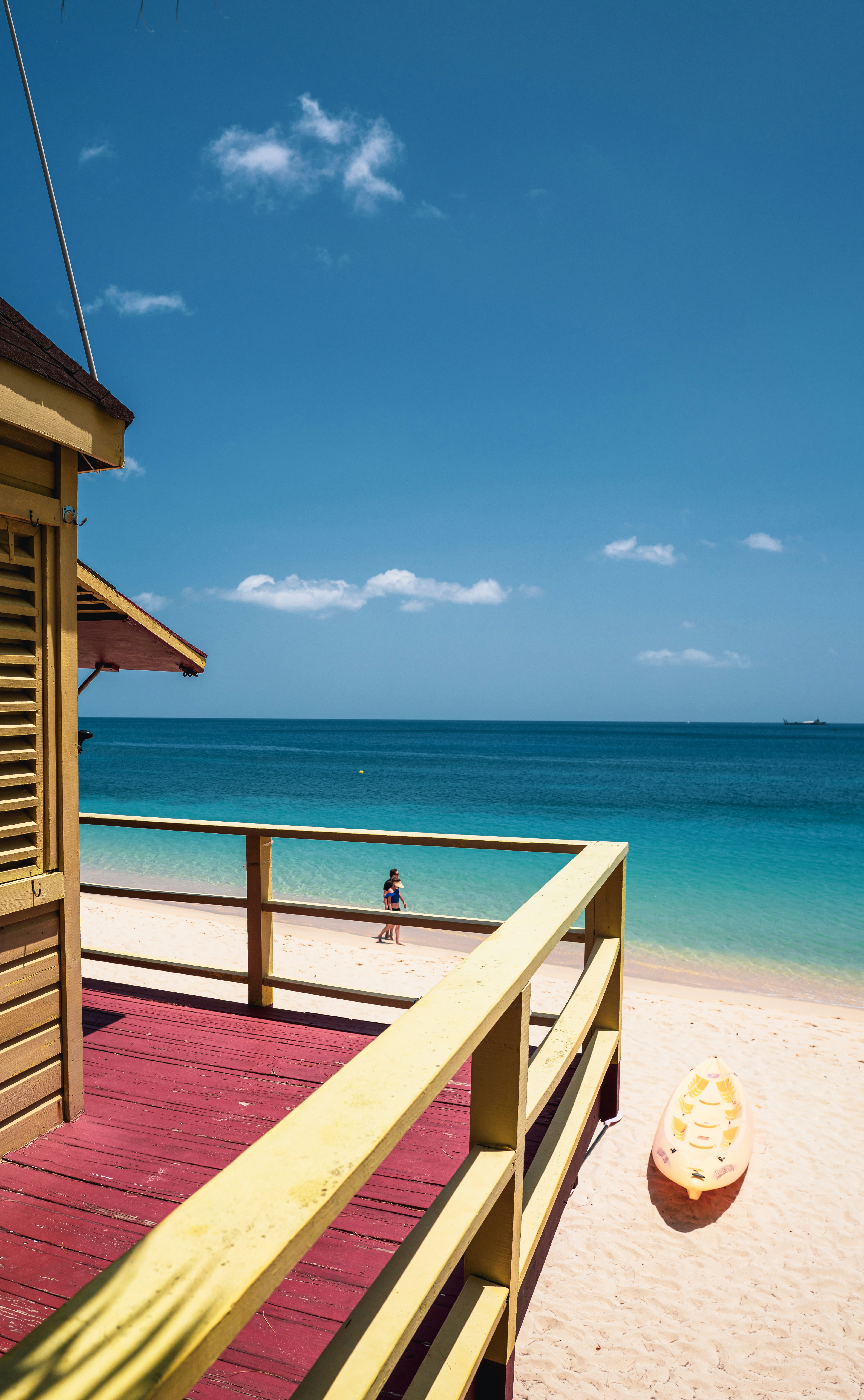 Sunlit Deck Overlooking Turquoise Waters
