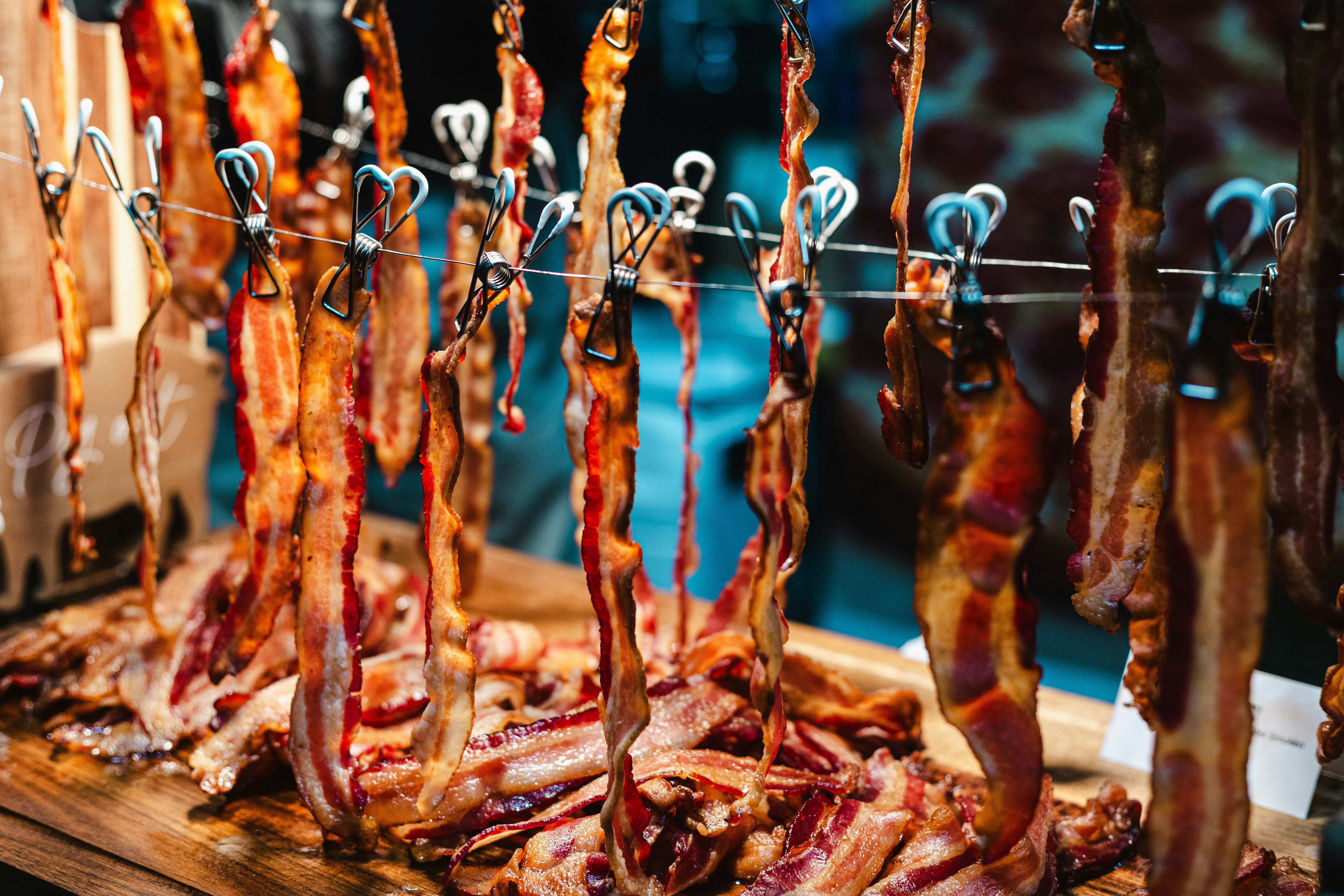 Cascading Ribbons of Crisp: Bacon Strung on a Line
