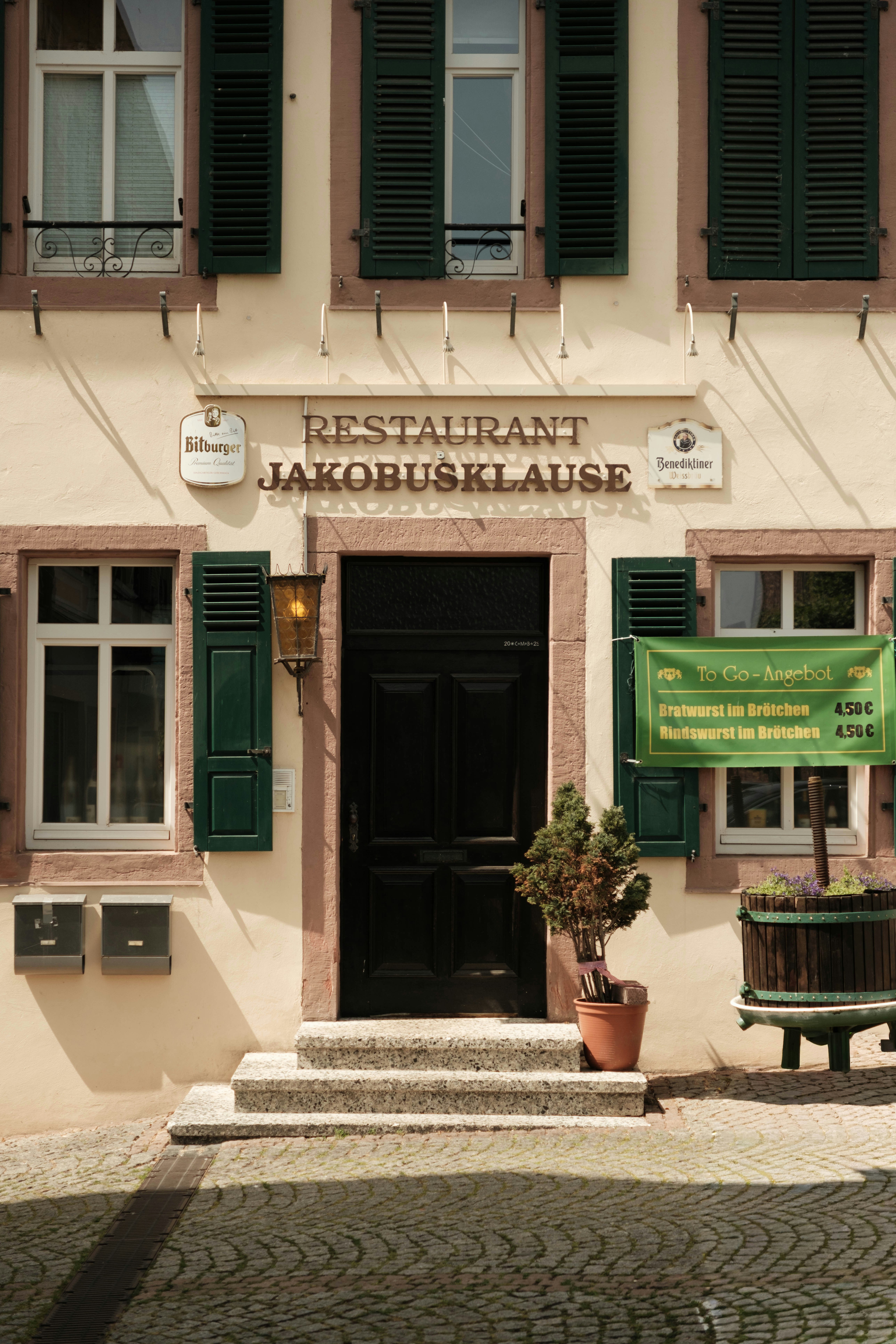 Restaurant jakobusklaus building with green shutters and a black door ...