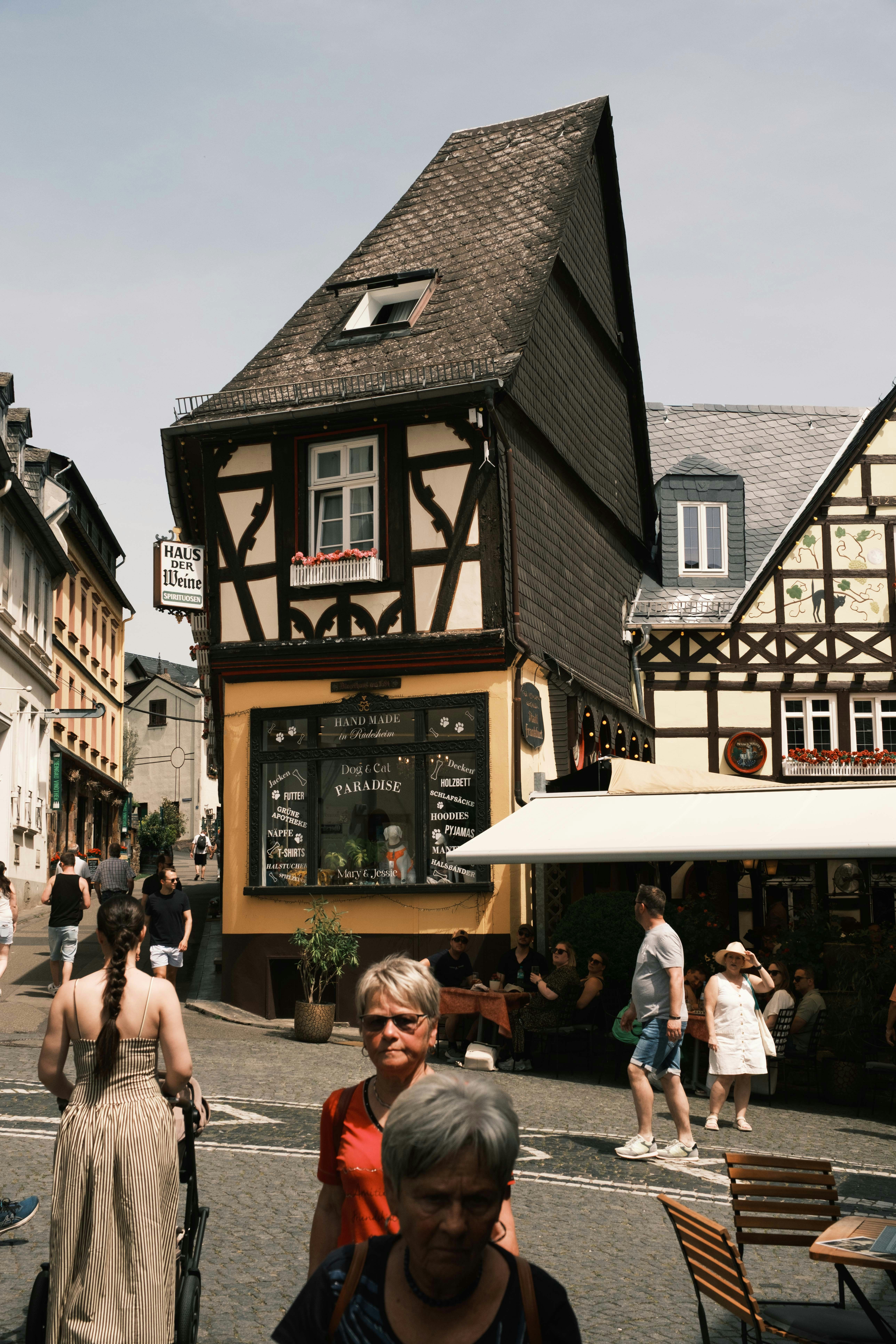 Sunlit Street Café Under a Timeless Fachwerk House