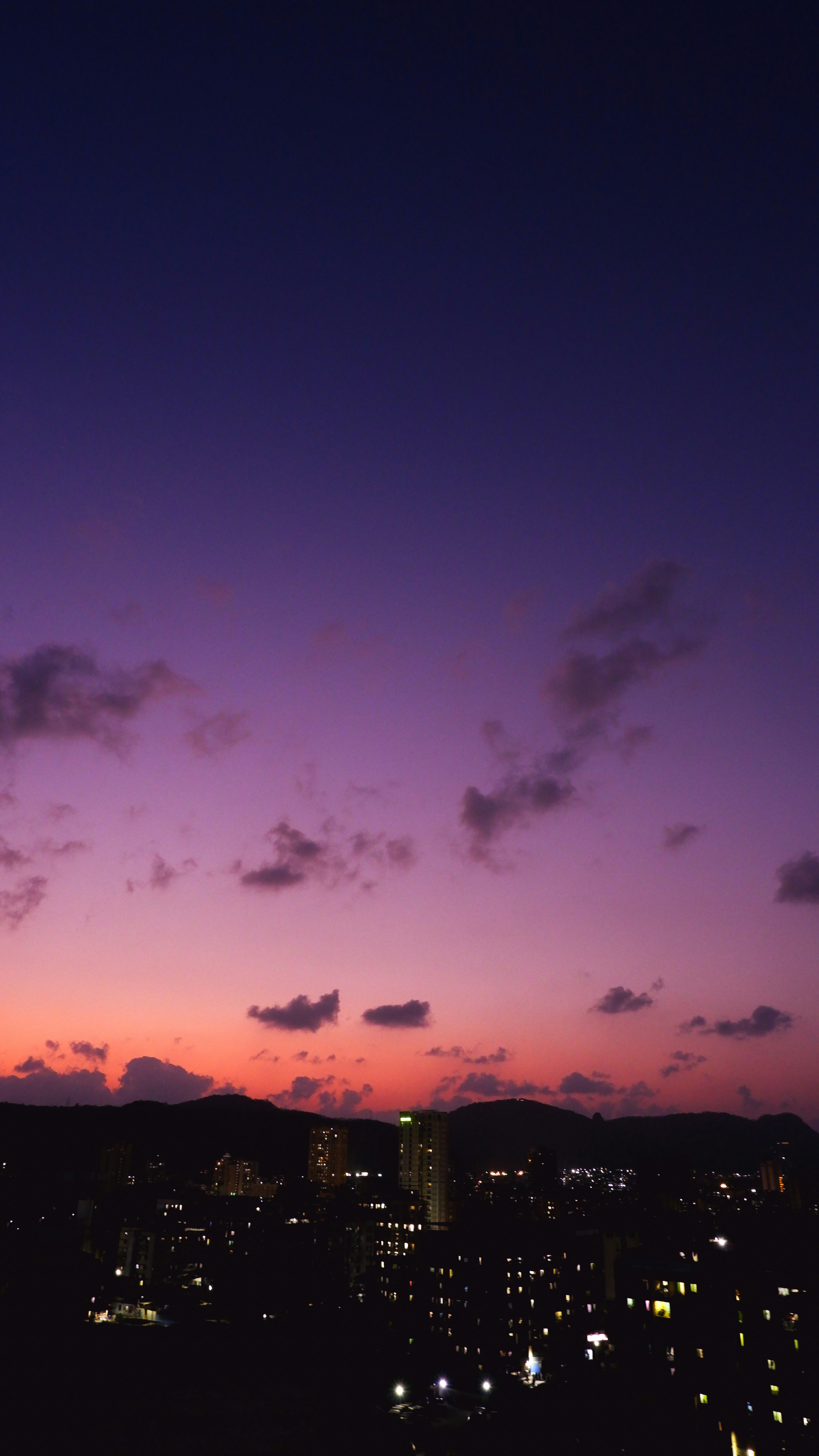 Twilight Skyline: City Lights Beneath a Velvet Gradient