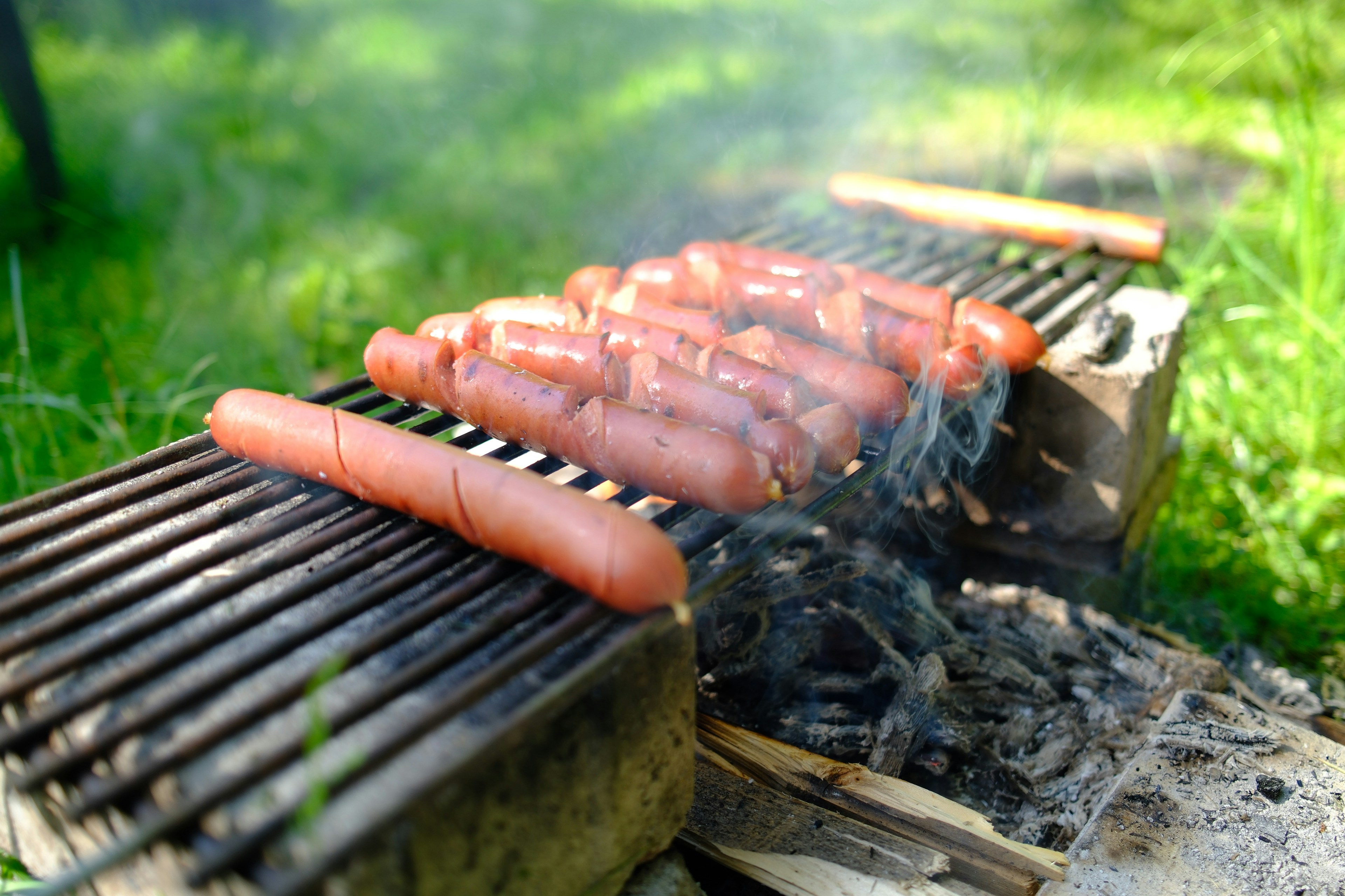 Sizzling Sausages on a Backyard Grill: Morning Smoky Grilling Scene