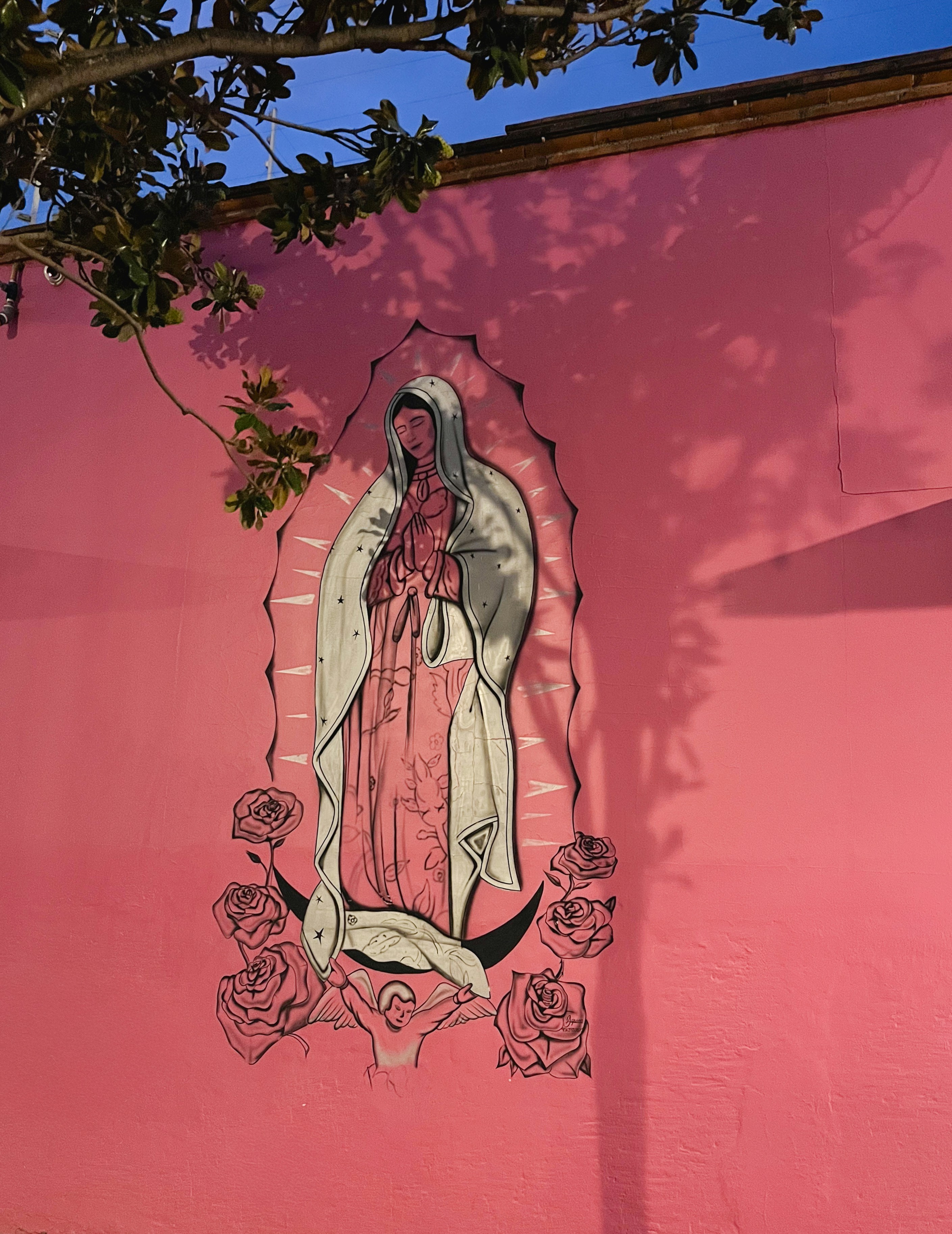 Virgin of the Pink Wall: A Sacred Fresco Painted on Warm Mauve Plaster
