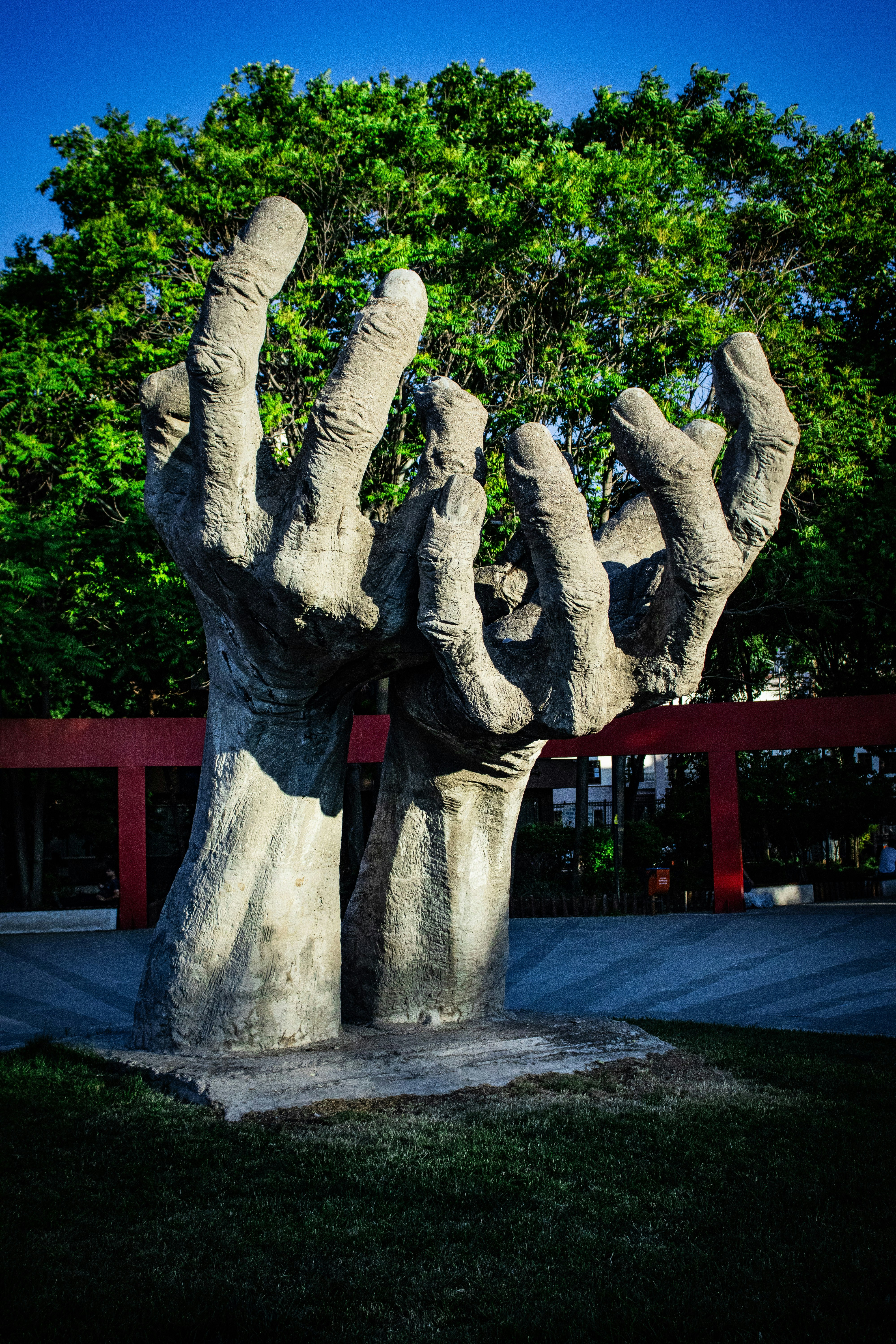 Earthbound Embrace: Monumental Hands Reaching Toward the Sky