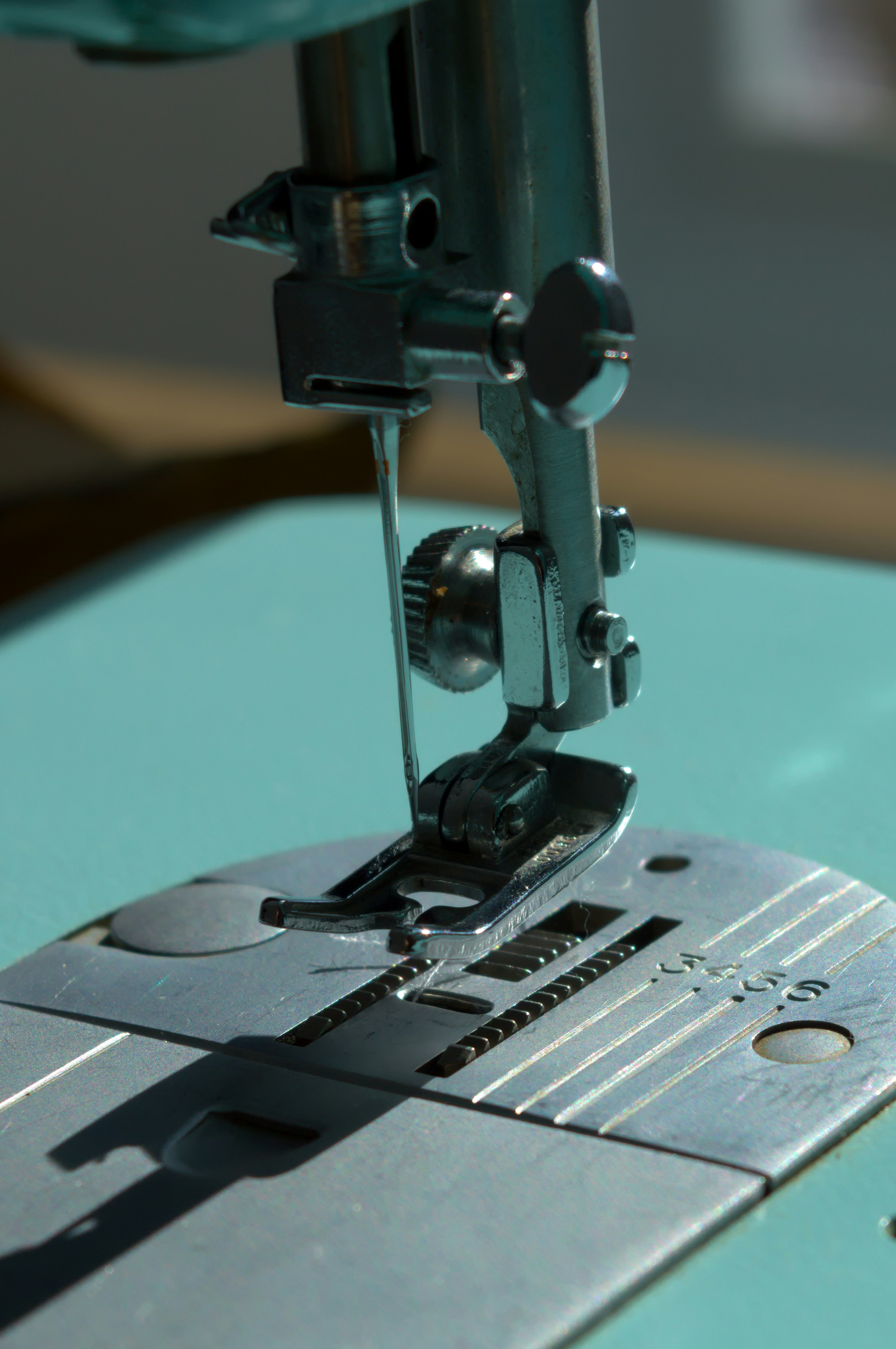 Sewing Machine Arm in Focus: A Close-Up on Metal Mechanics