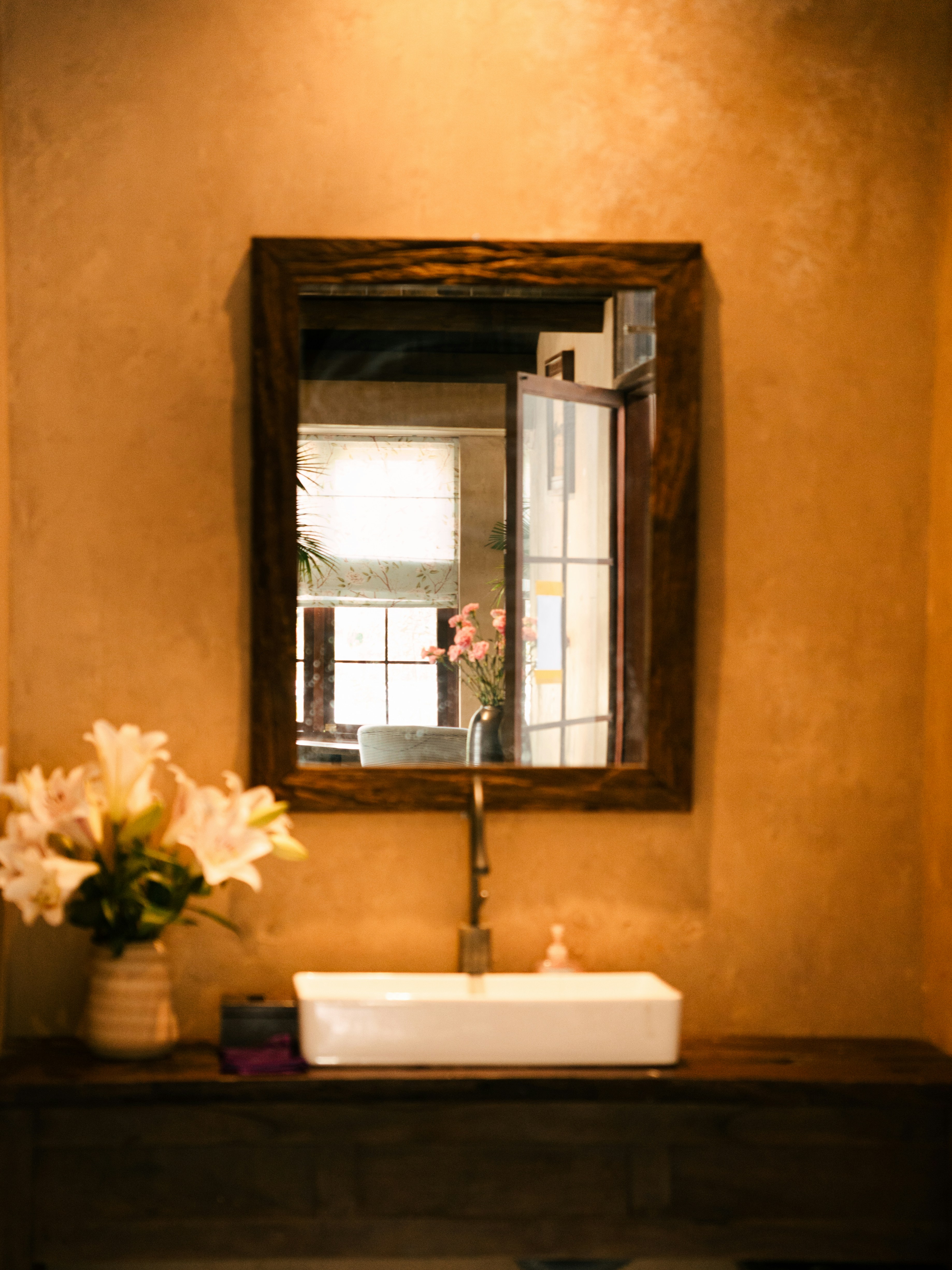 Framed Reflection: A Warm Bath of Light in a Vintage Vanity