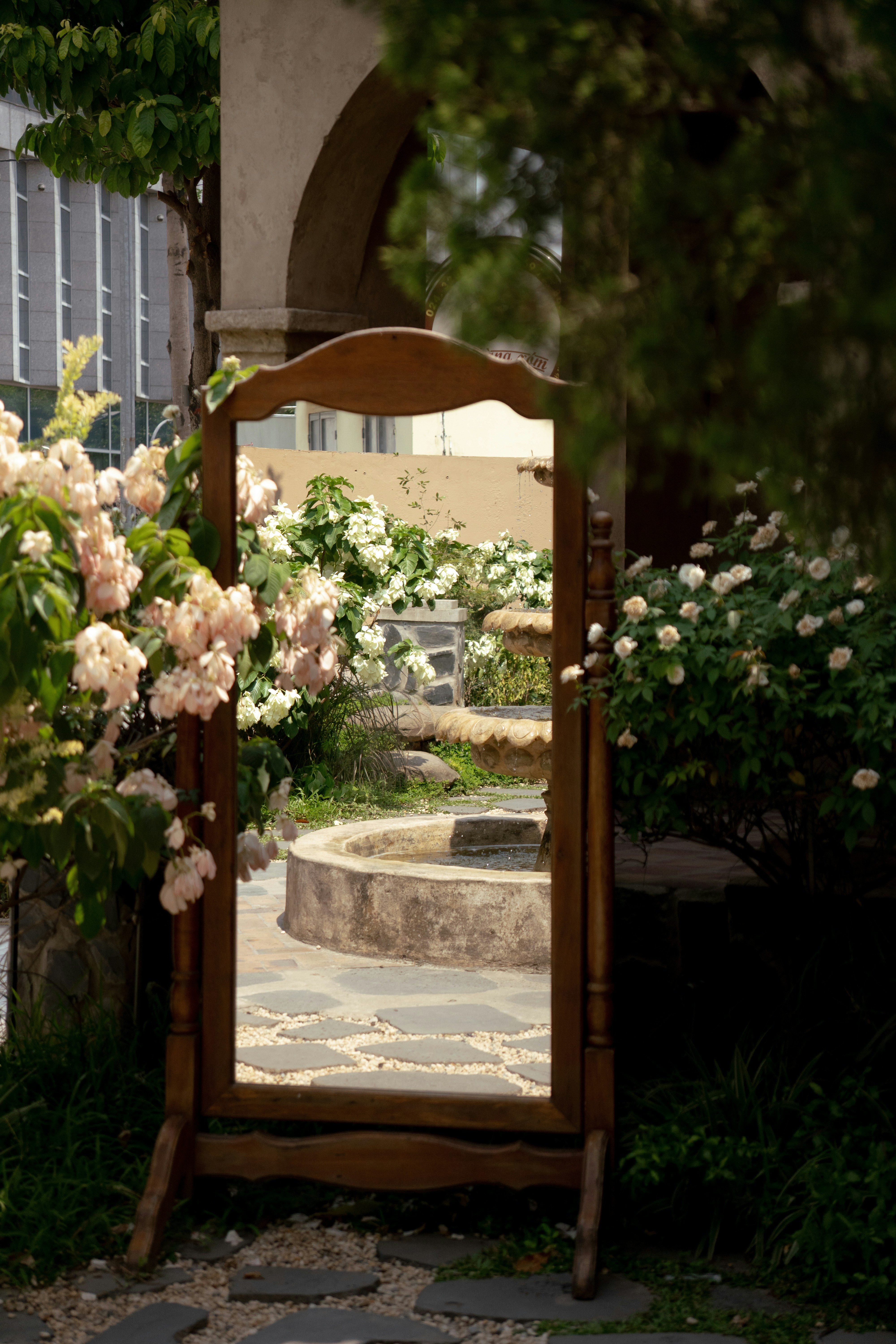 A Garden Mirror Framed by Blossoms