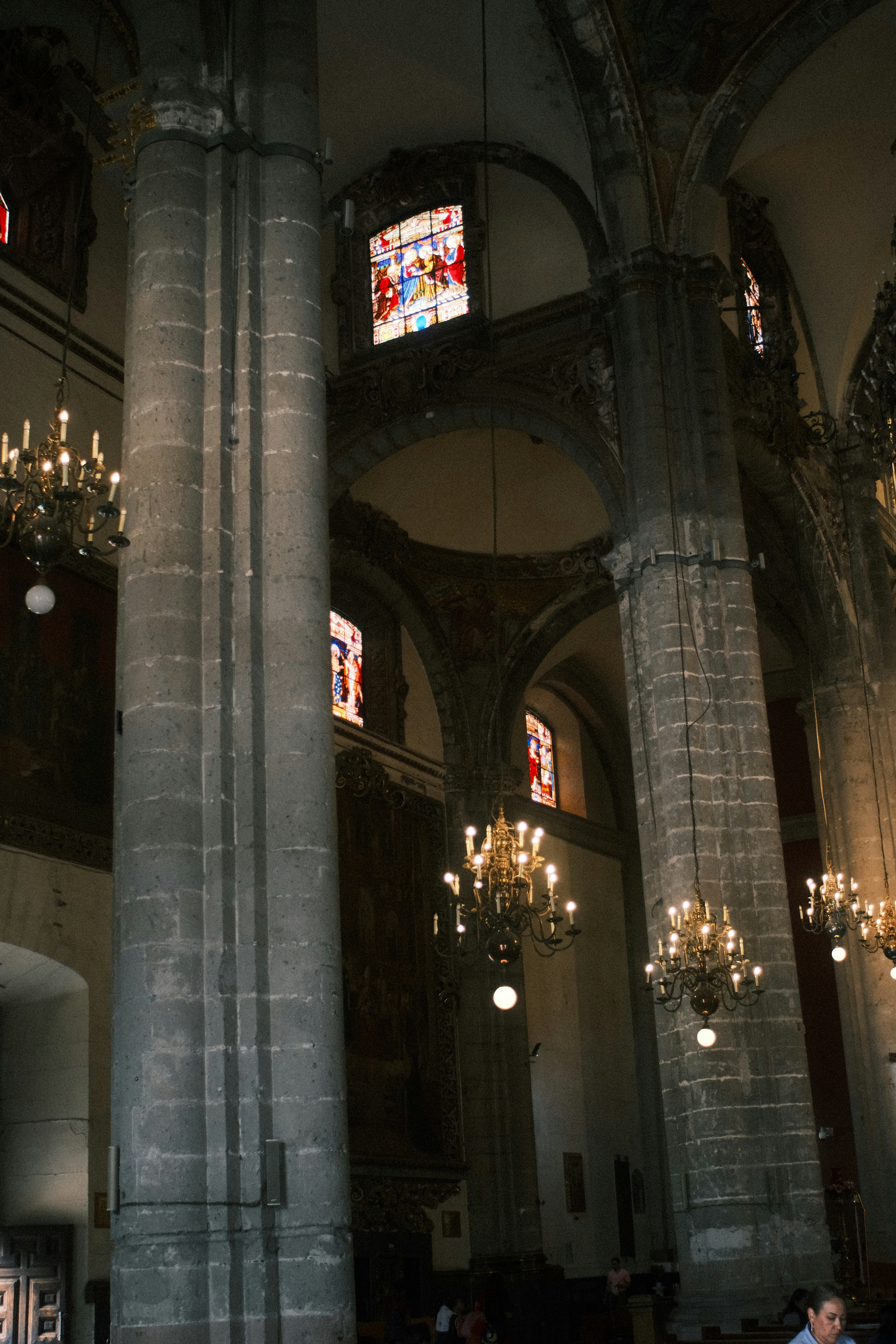 Cathedral Interior: Stained Glass and Gothic Columns in Quiet Dusk