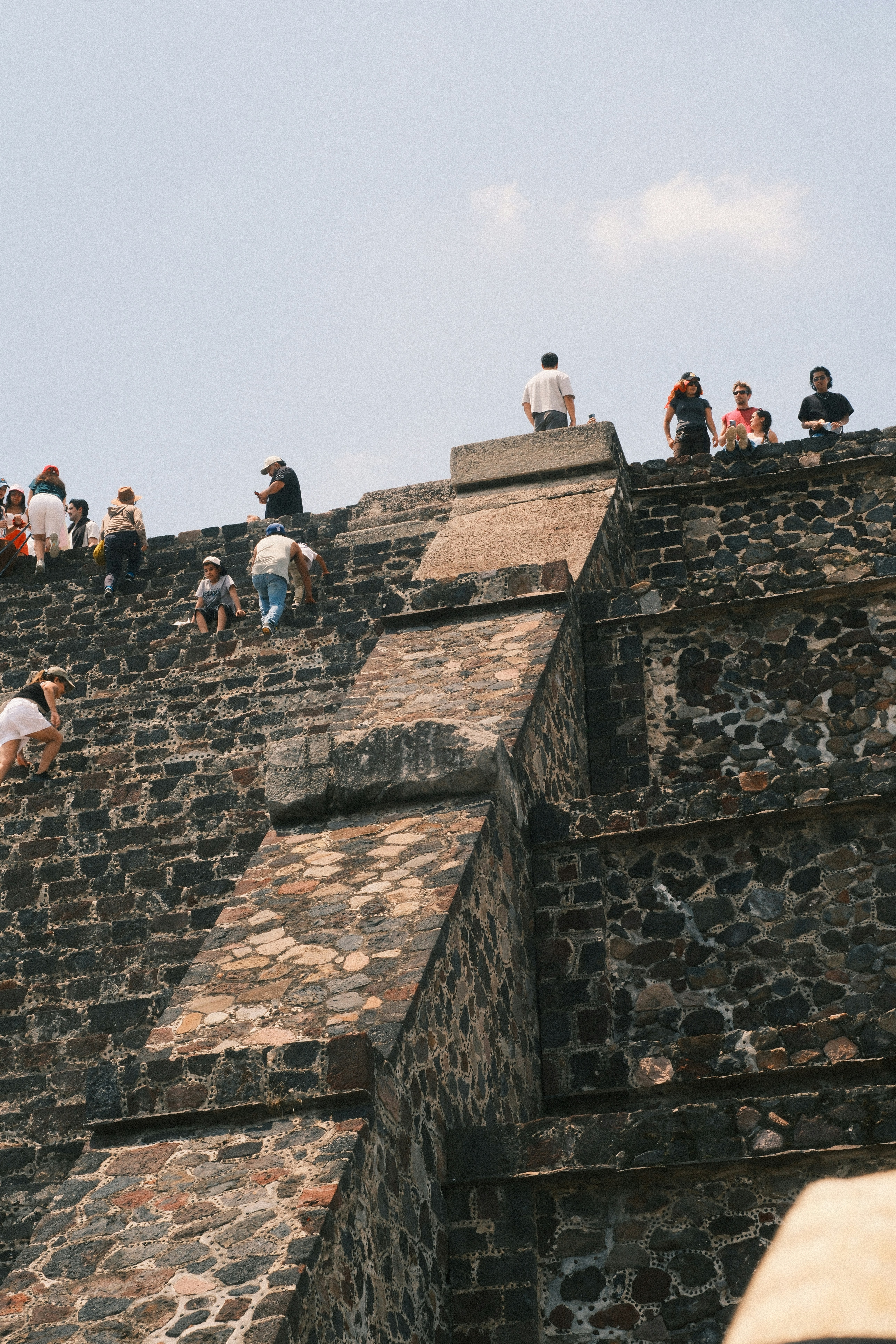 Visitors Cling to the Ancient Terrace: A Stone Staircase into History