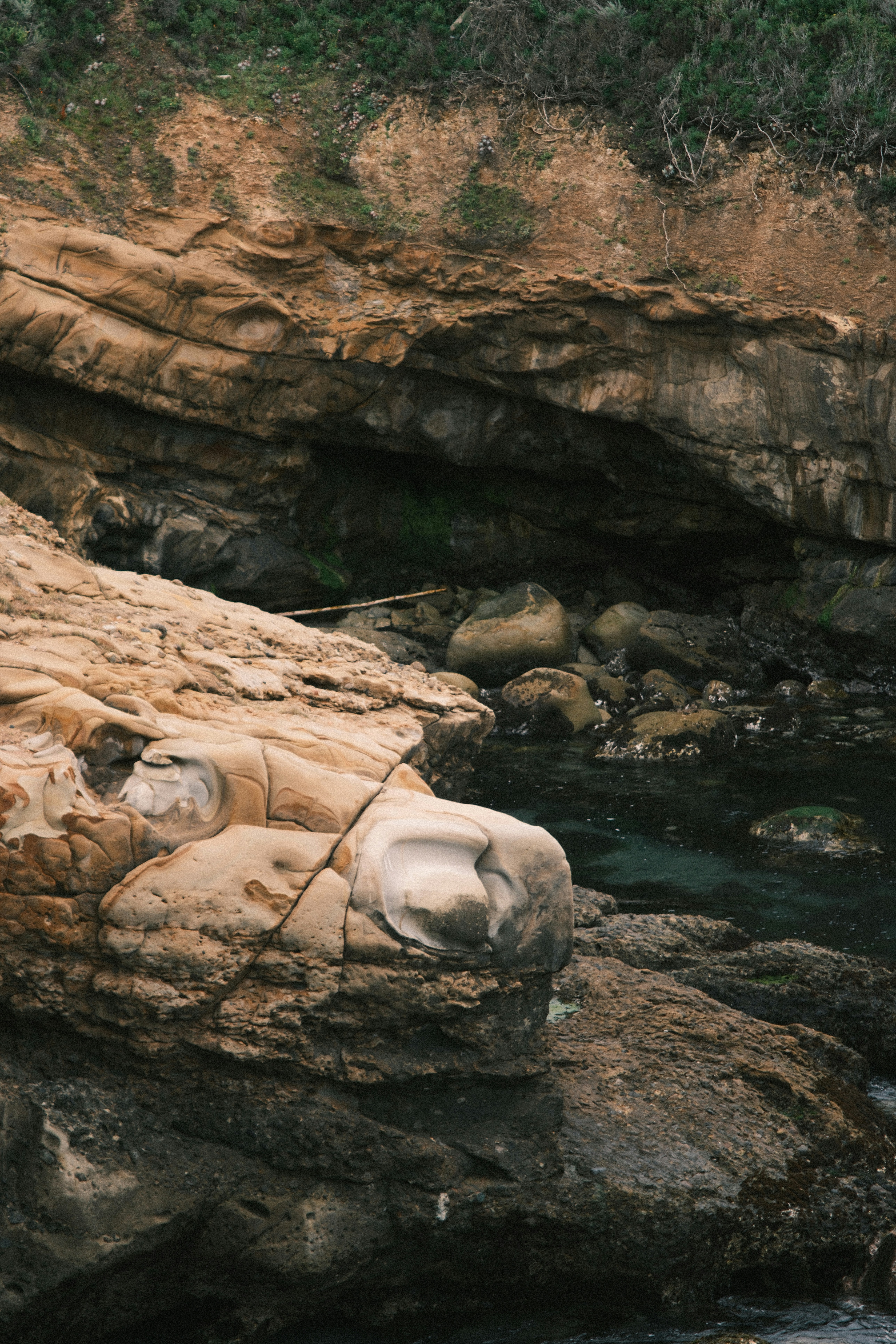 Layered Coastal Marble and Tidal Carvings