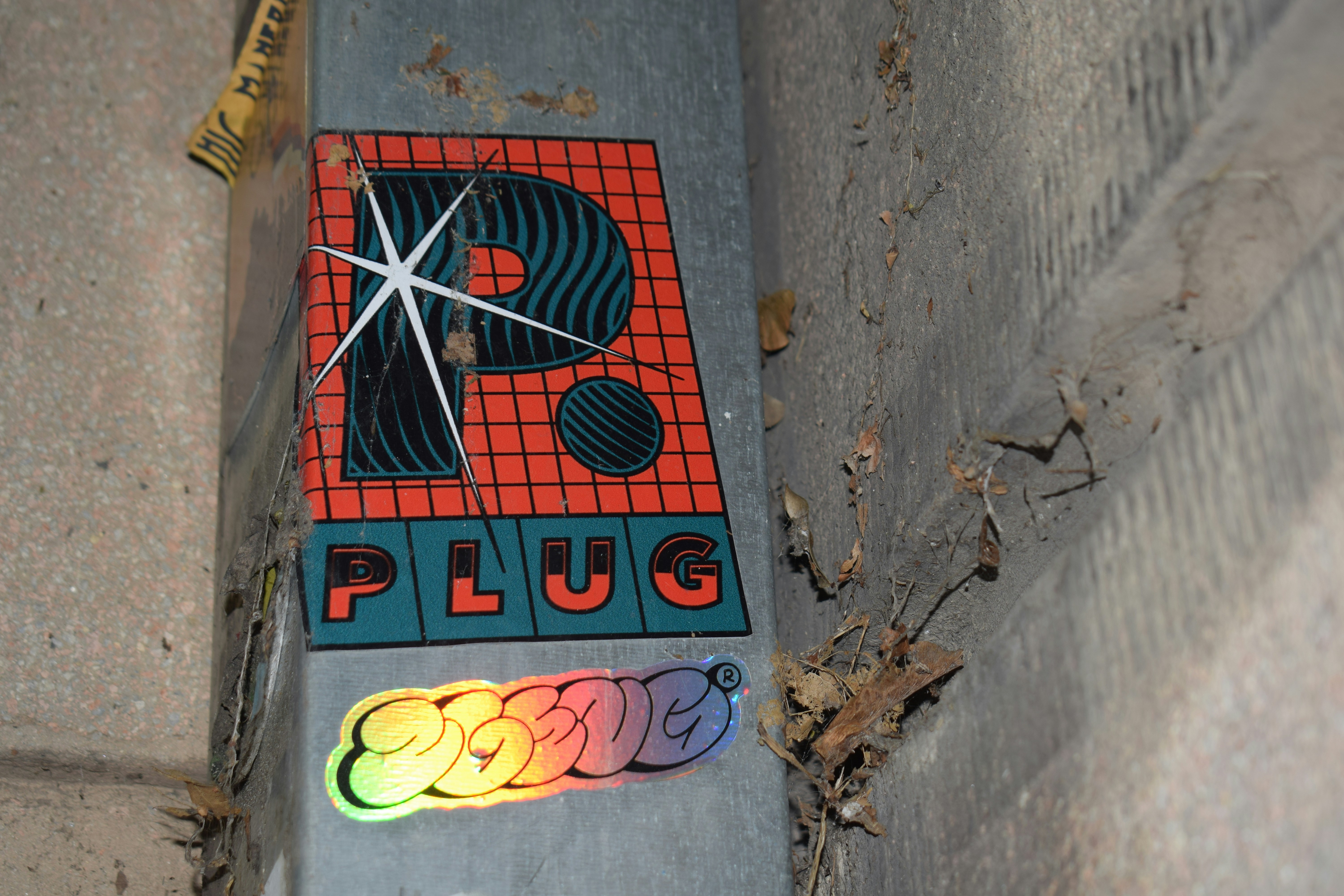 Neon Sticker on Industrial Steel—A Quiet Urban Detail